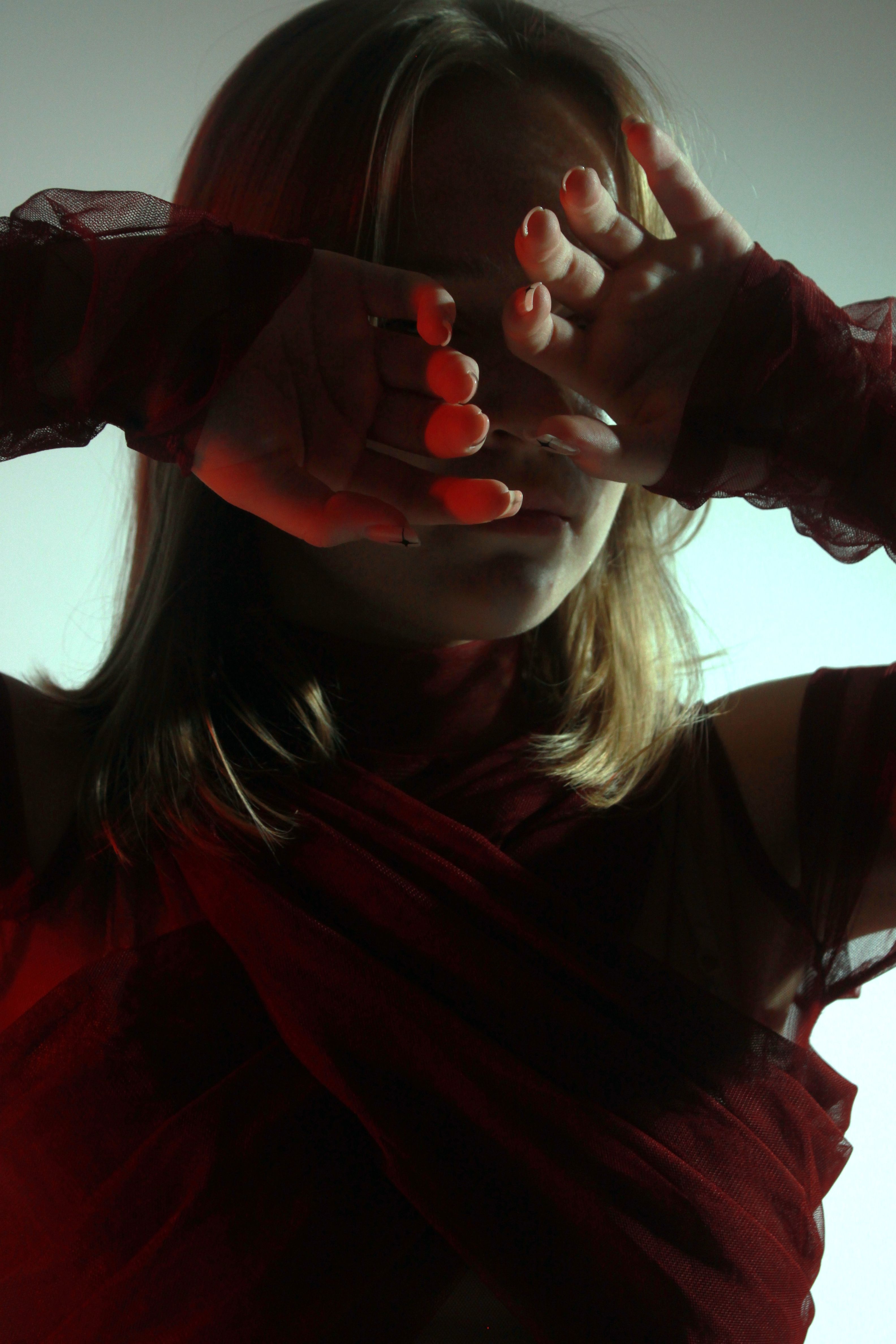 Woman in Gloves and with Hands around Face · Free Stock Photo