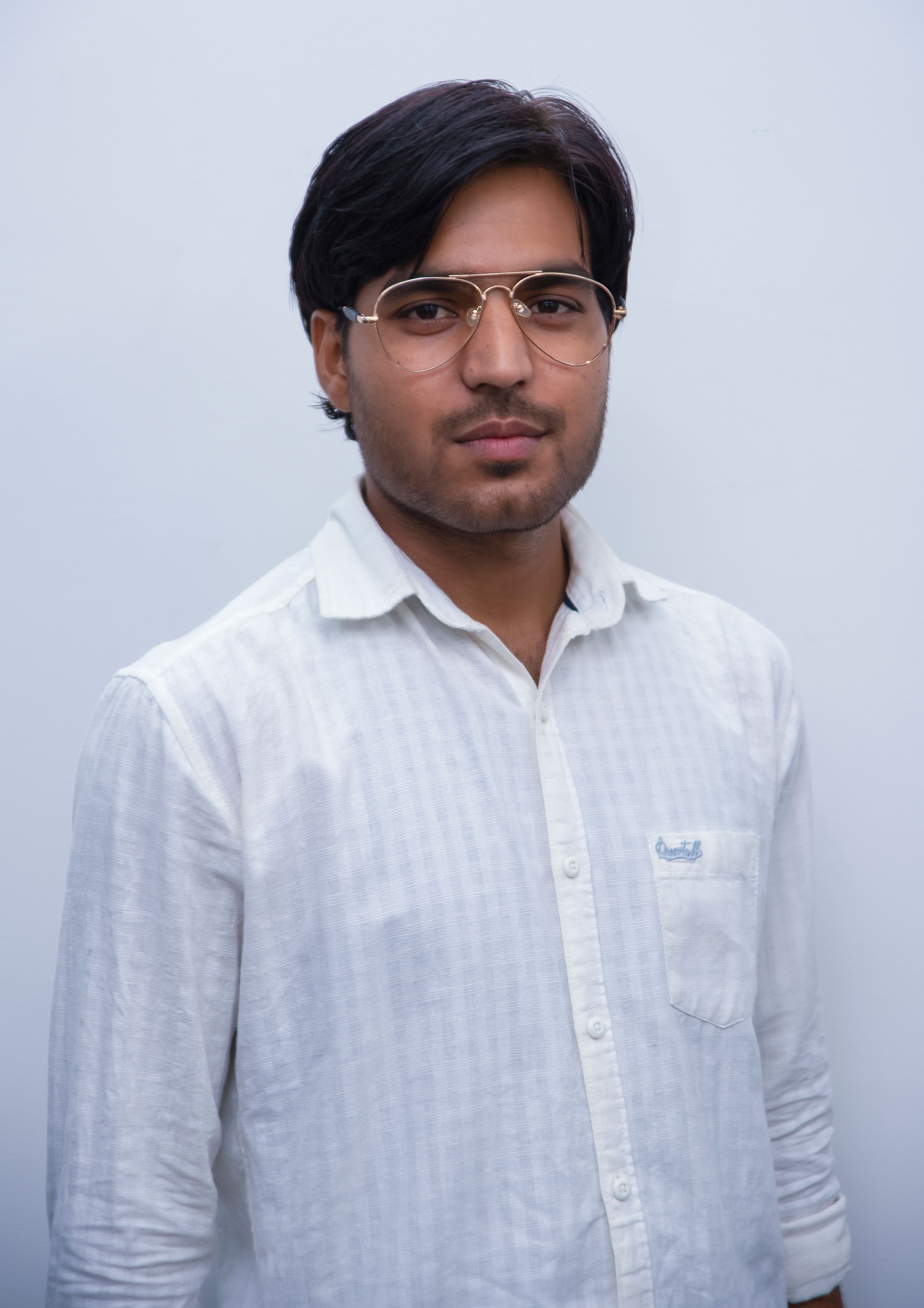 Modeling photo shoot young man in white shirt and glass wared · Free ...
