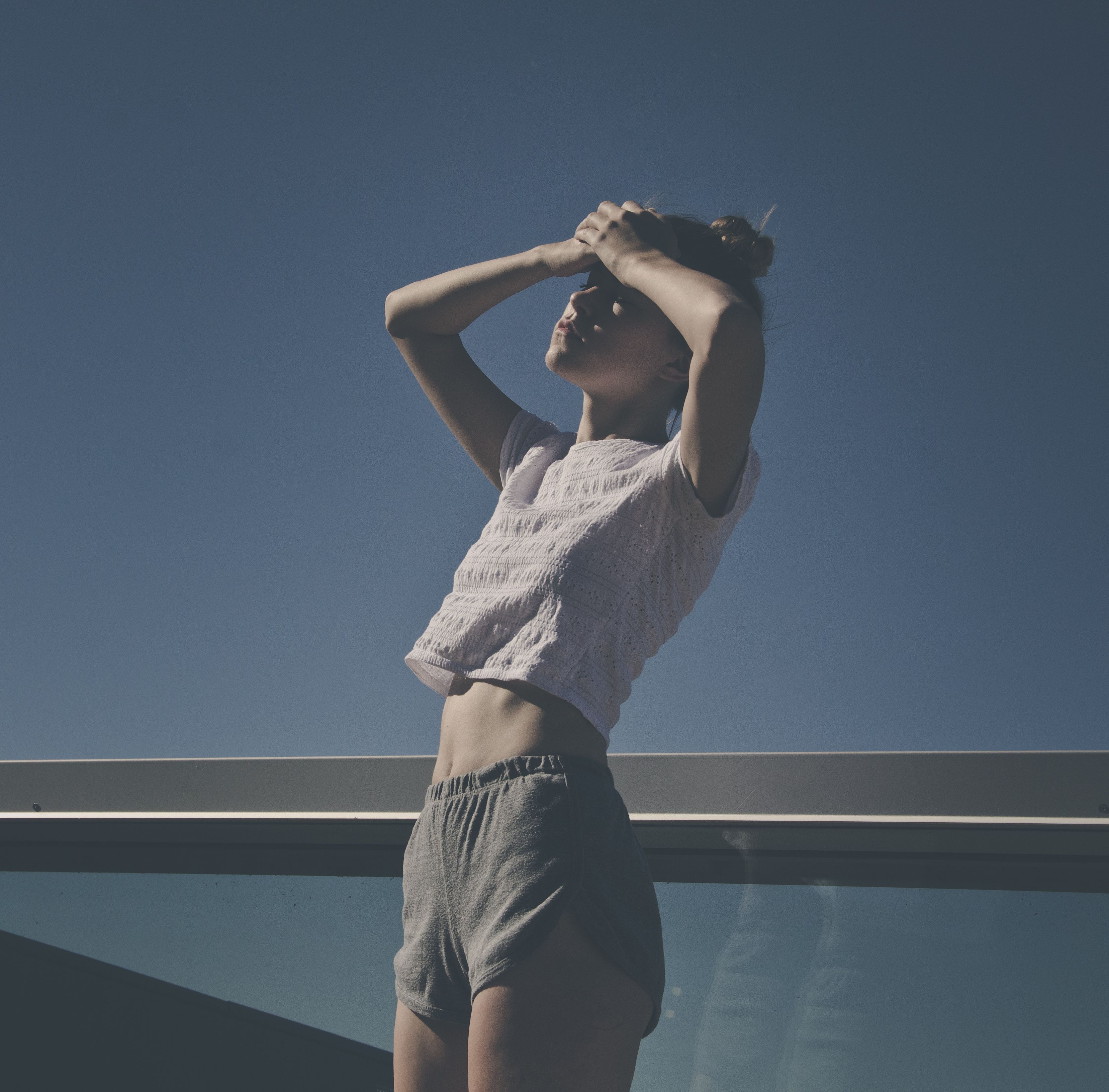 Shallow Focus Photo Of Woman In White Crop Top T-shirt · Free Stock Photo