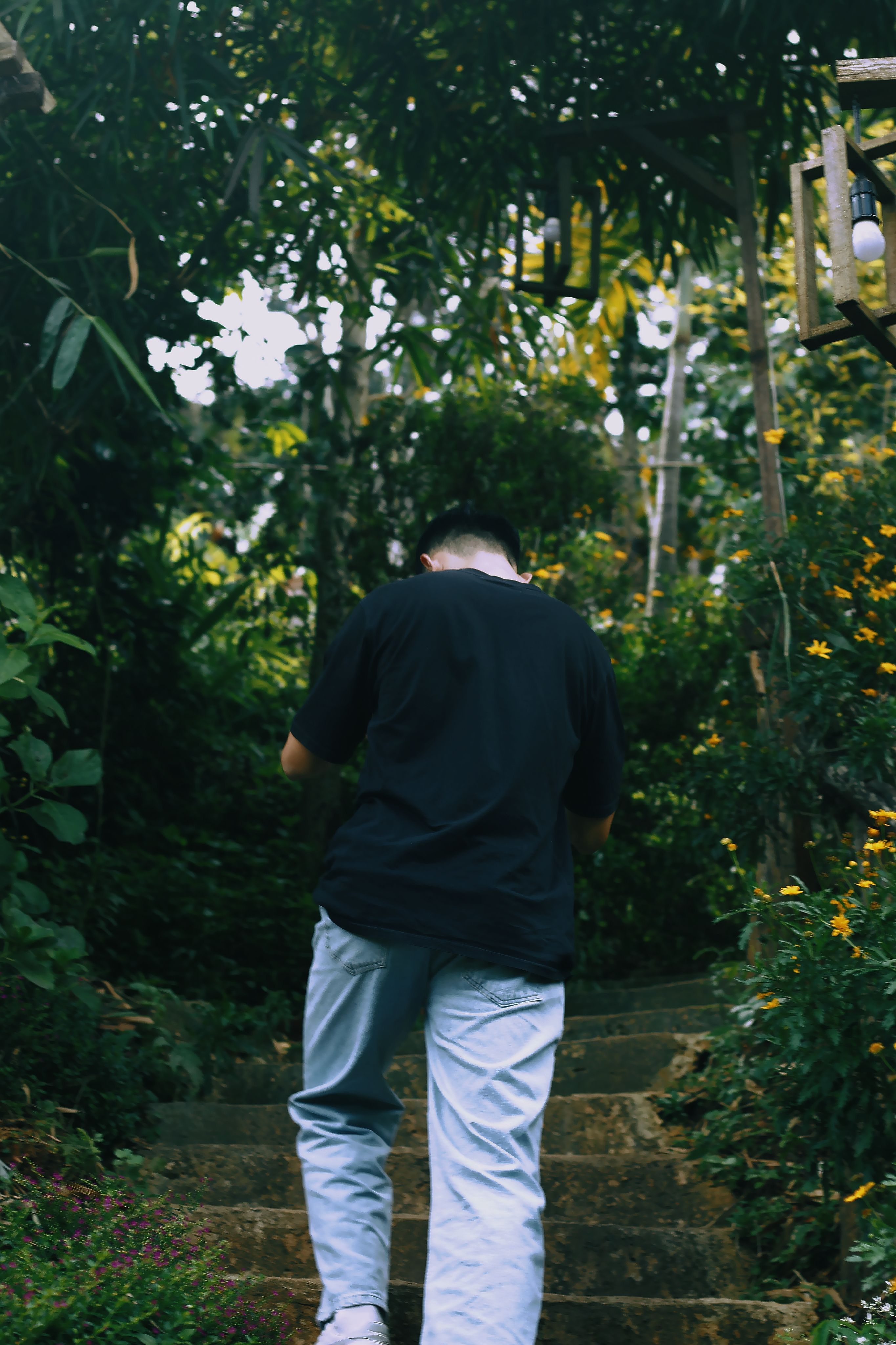 Young Man Walking up the Concrete Steps in a Park · Free Stock Photo