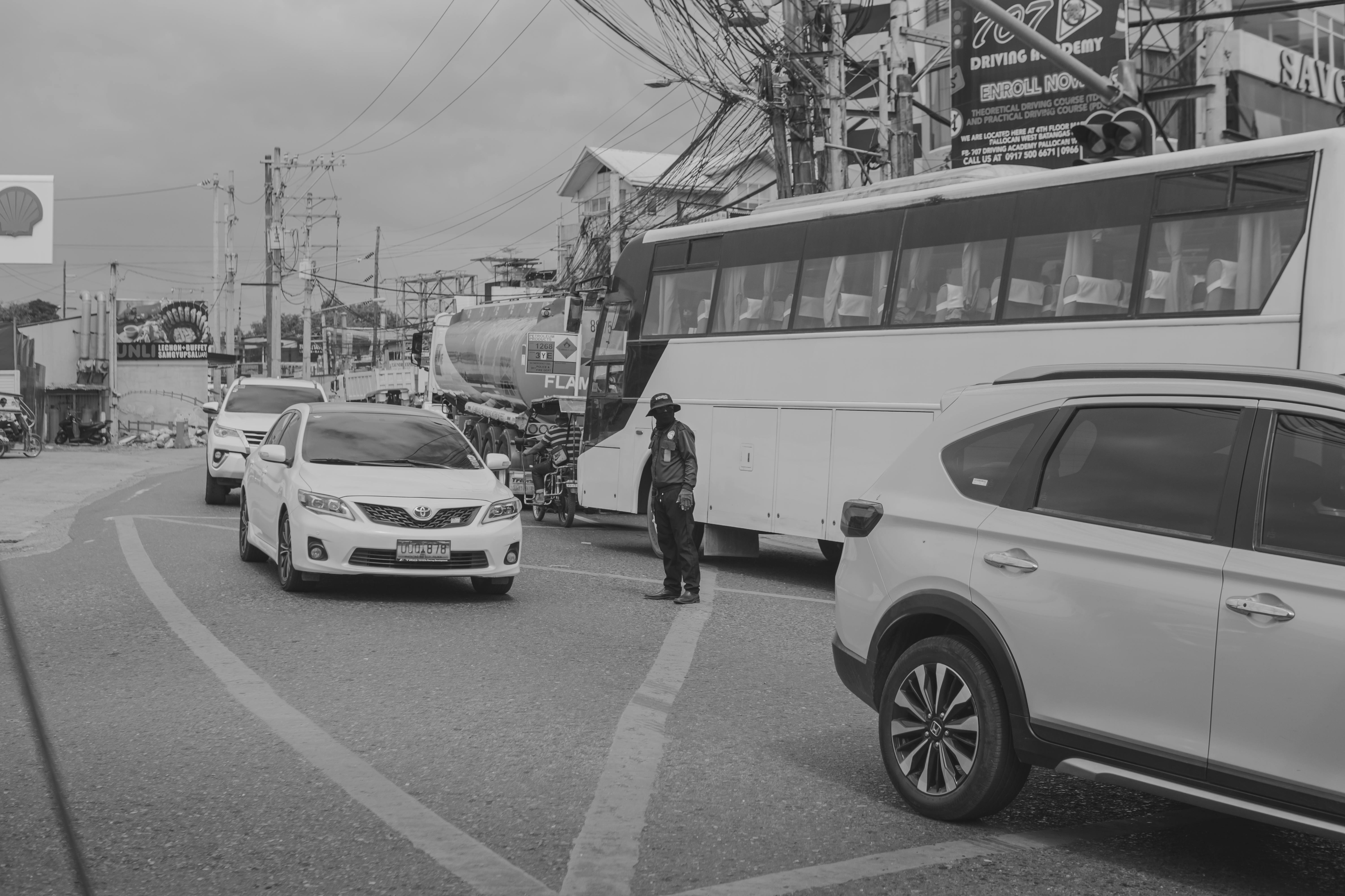 Police Officer Directing Traffic on a Busy Road · Free Stock Photo