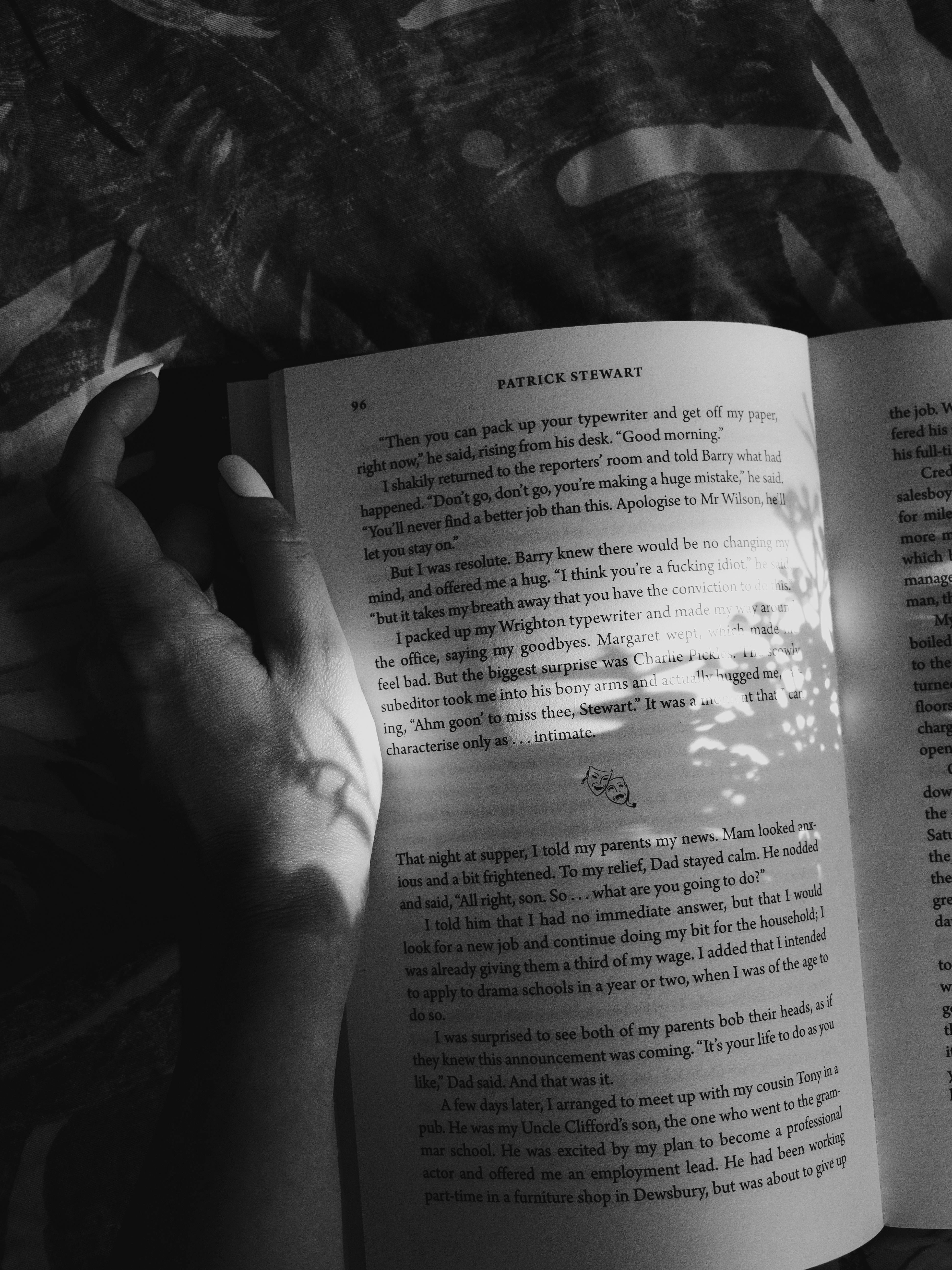 Woman Hand over Book Page in Black and White · Free Stock Photo