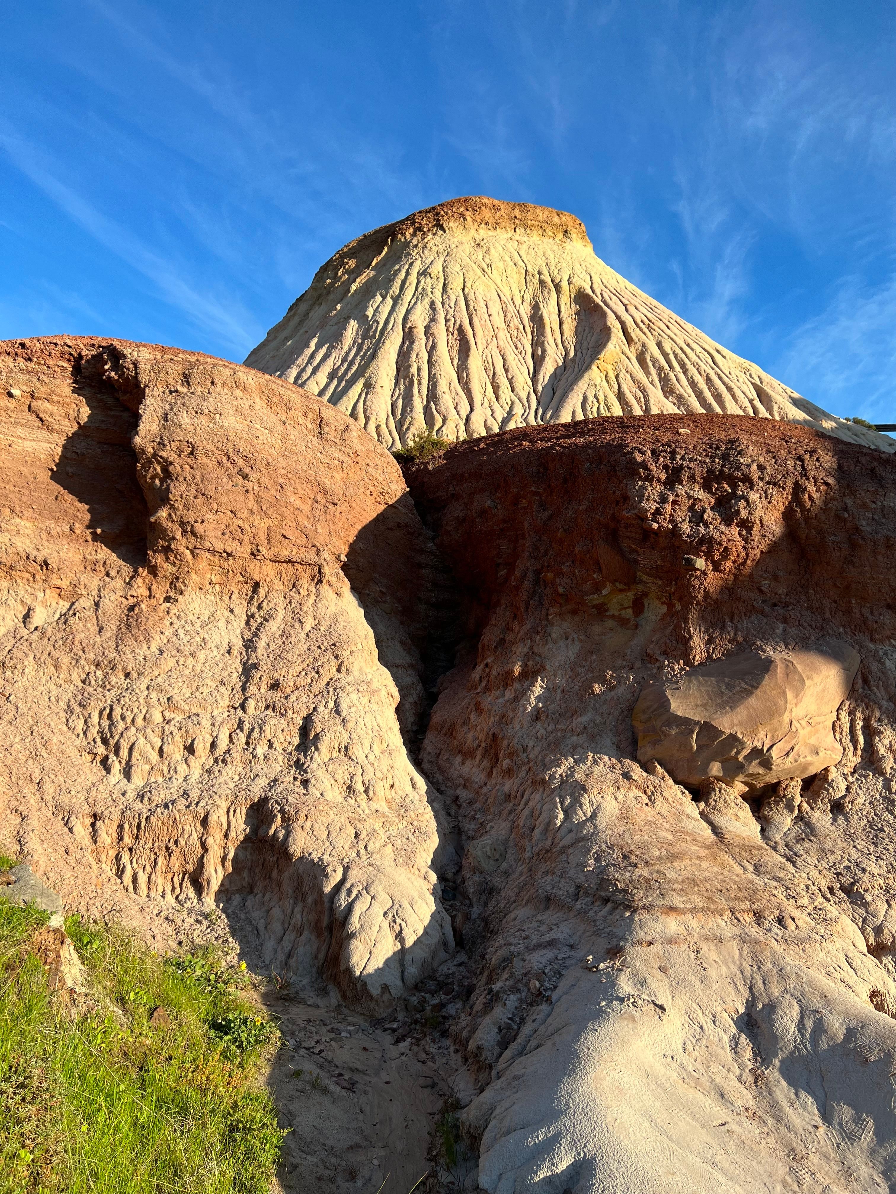 Sunlit Rock Formations on Hill · Free Stock Photo