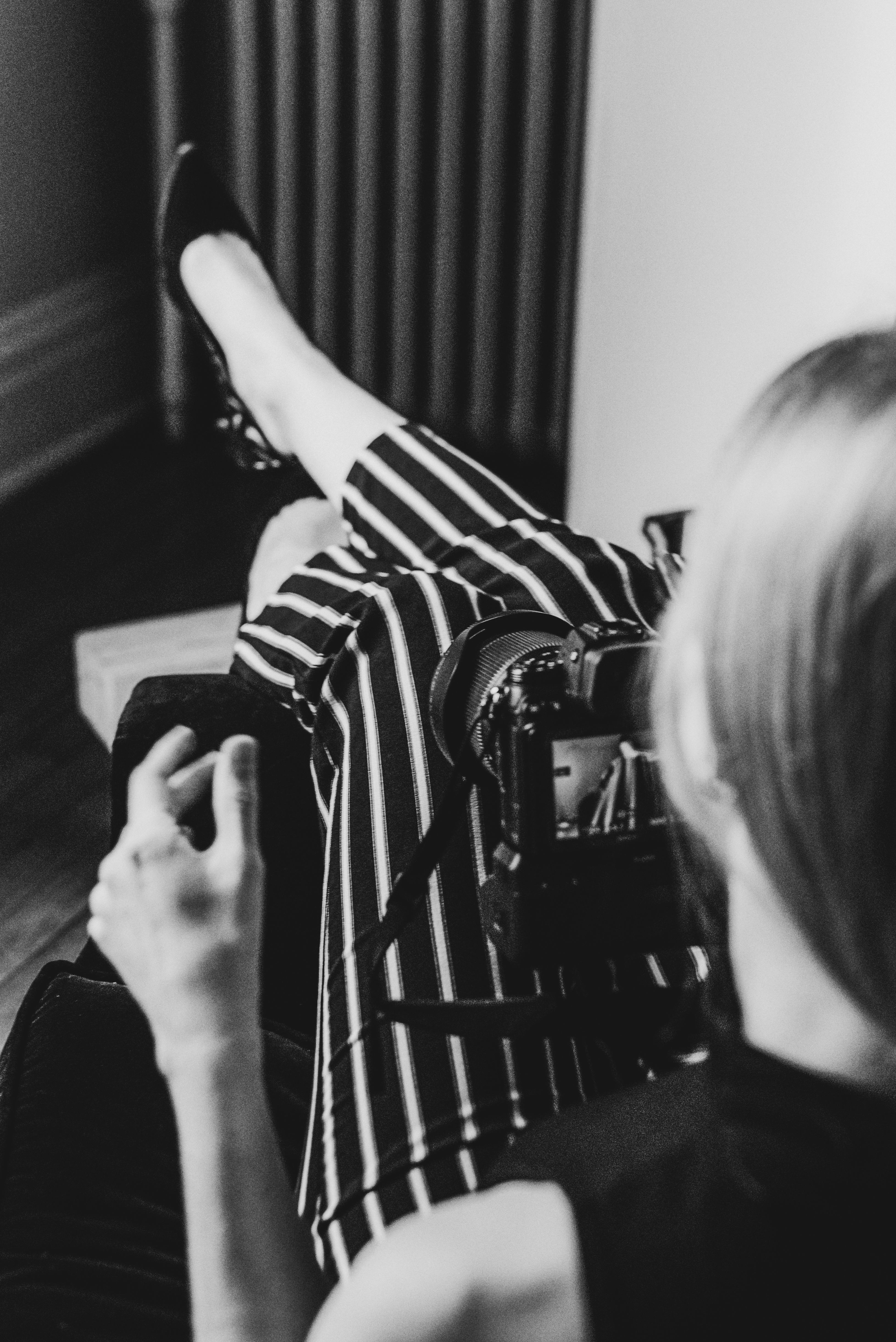 Woman Sitting and Taking Pictures with Camera · Free Stock Photo