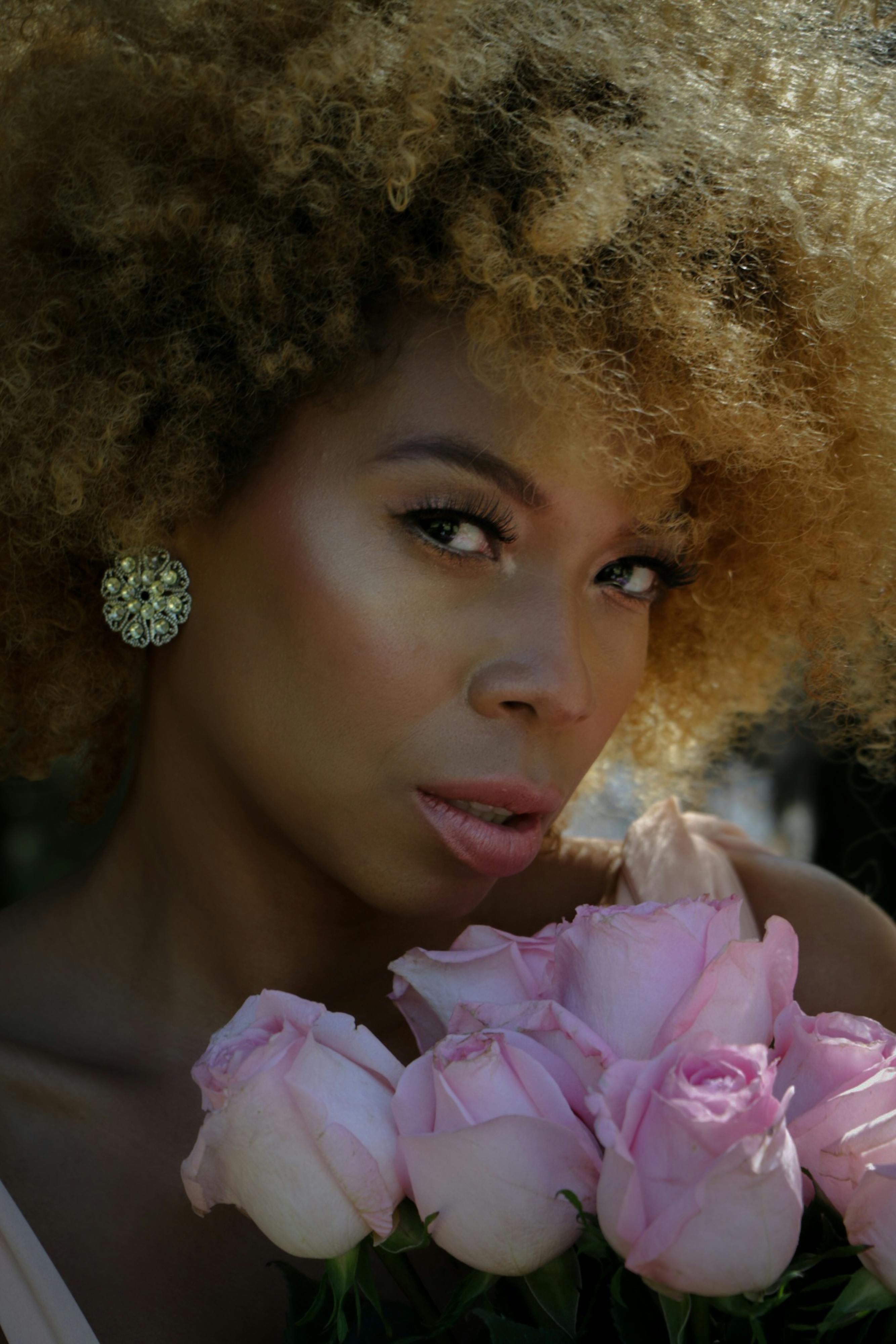 Portrait of Woman with Pink Roses · Free Stock Photo