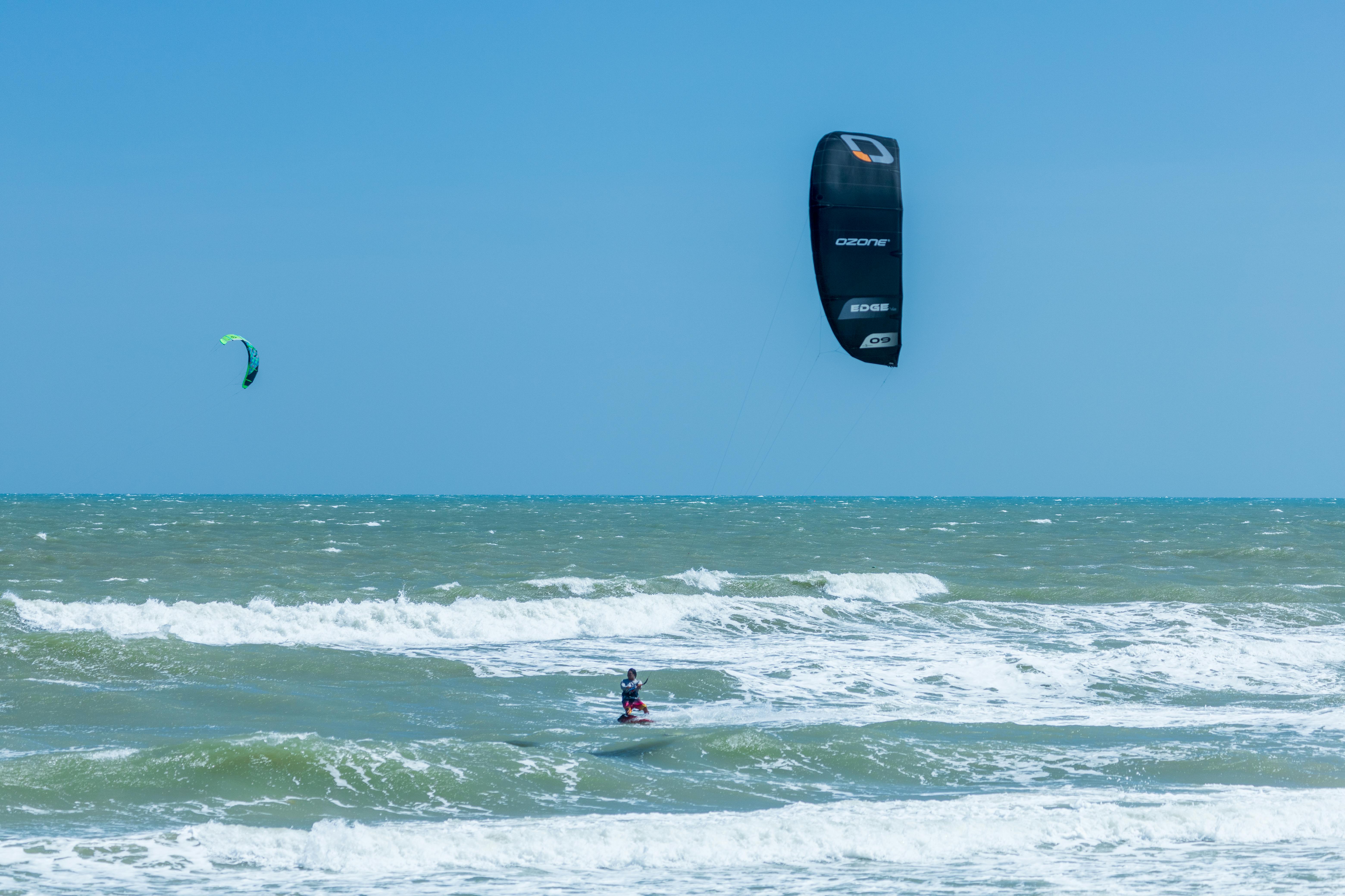 Person Riding Surf Board · Free Stock Photo