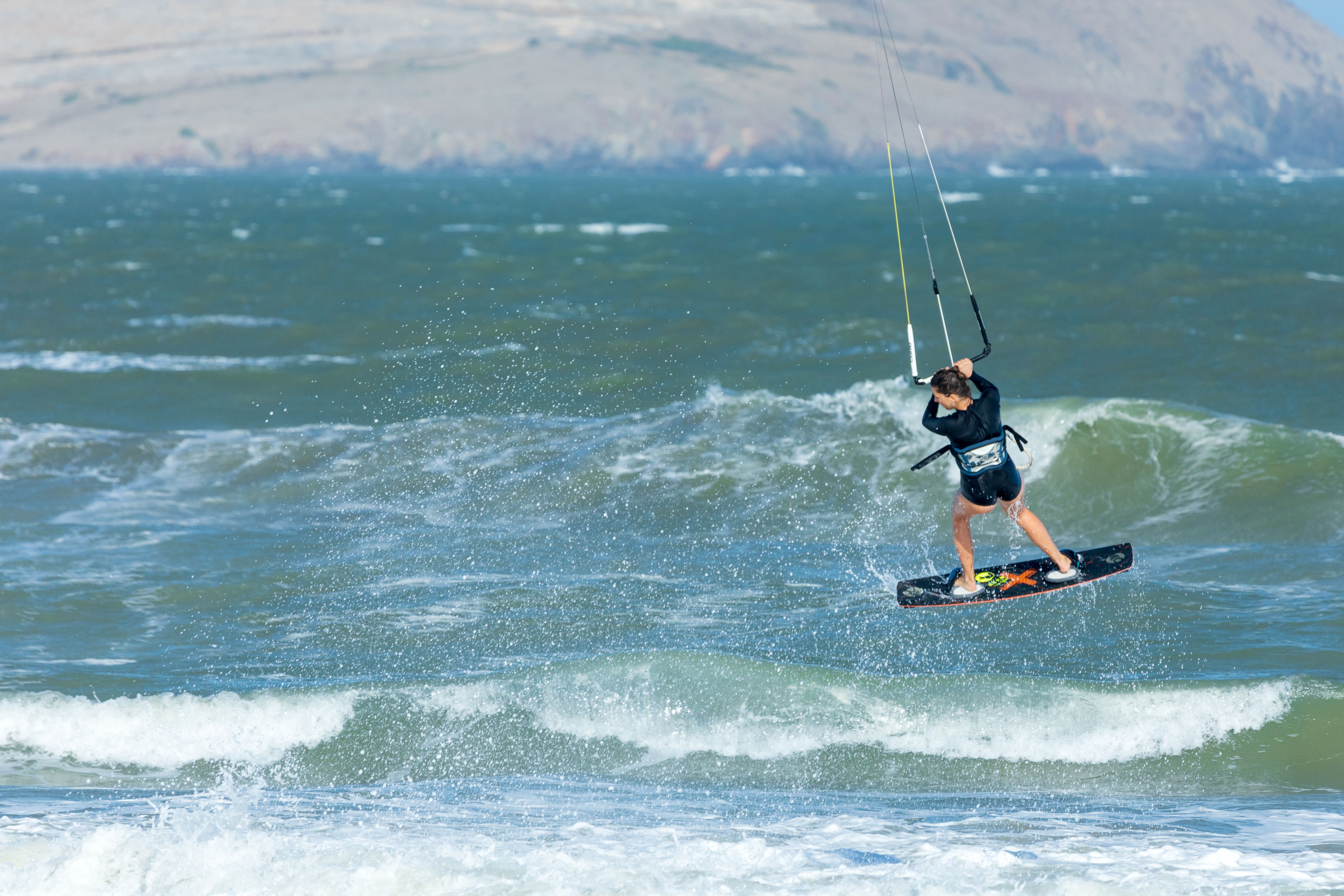 Active Woman Kitesurfing on Sea · Free Stock Photo