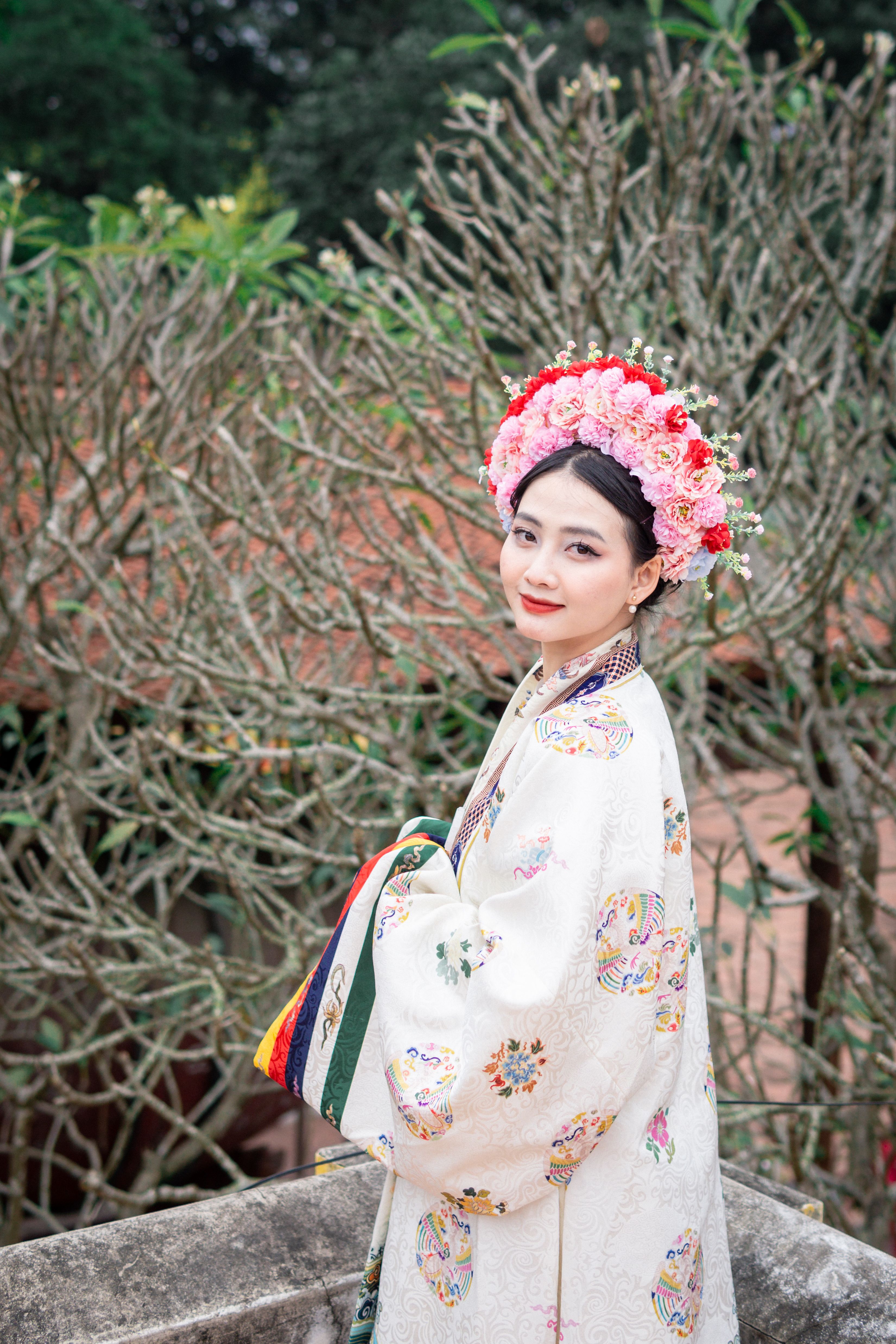 Bride in Traditional Gown and Floral Wreath on Head · Free Stock Photo