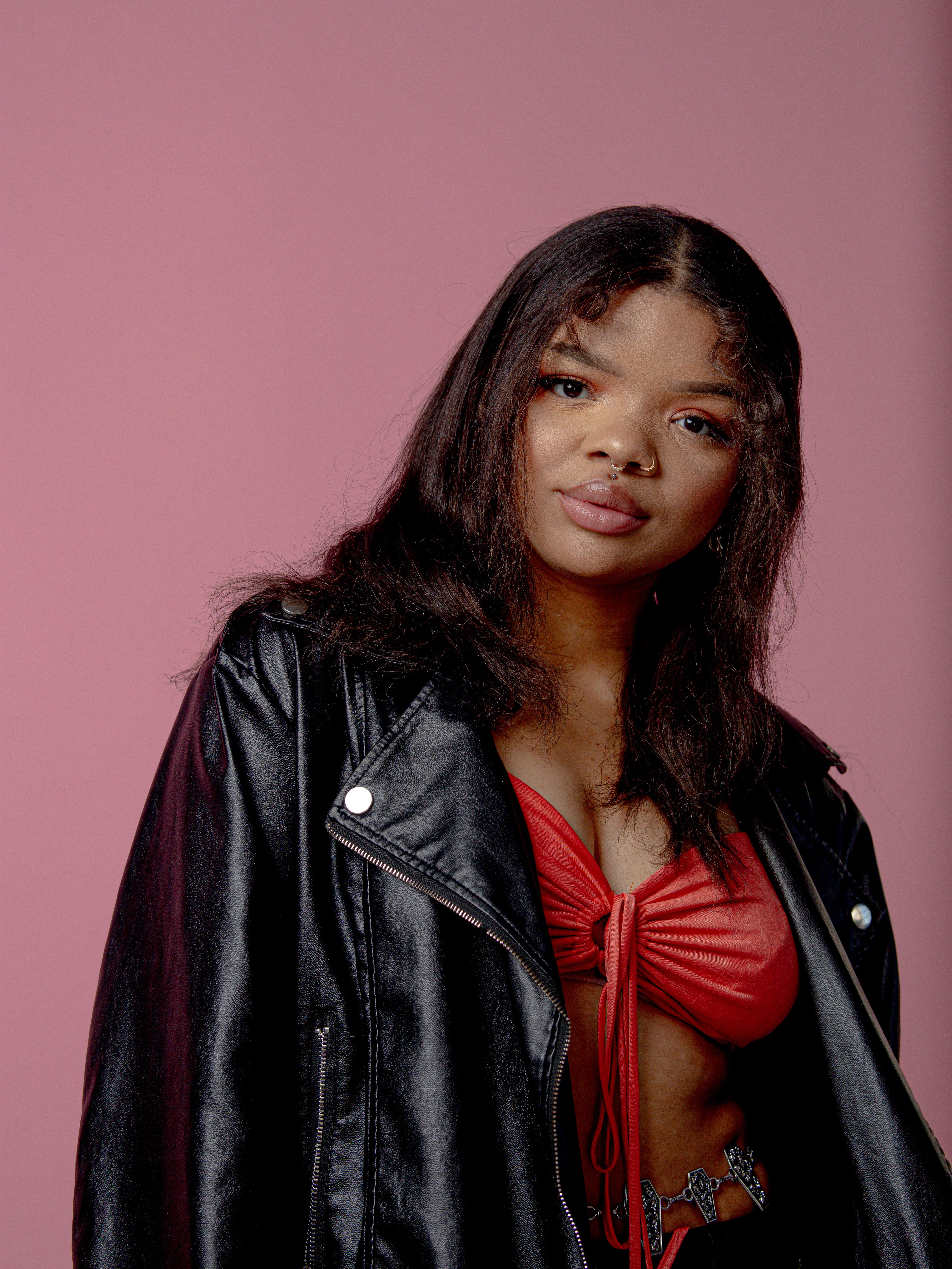 Woman in Red Bra and Black Leather Jacket · Free Stock Photo