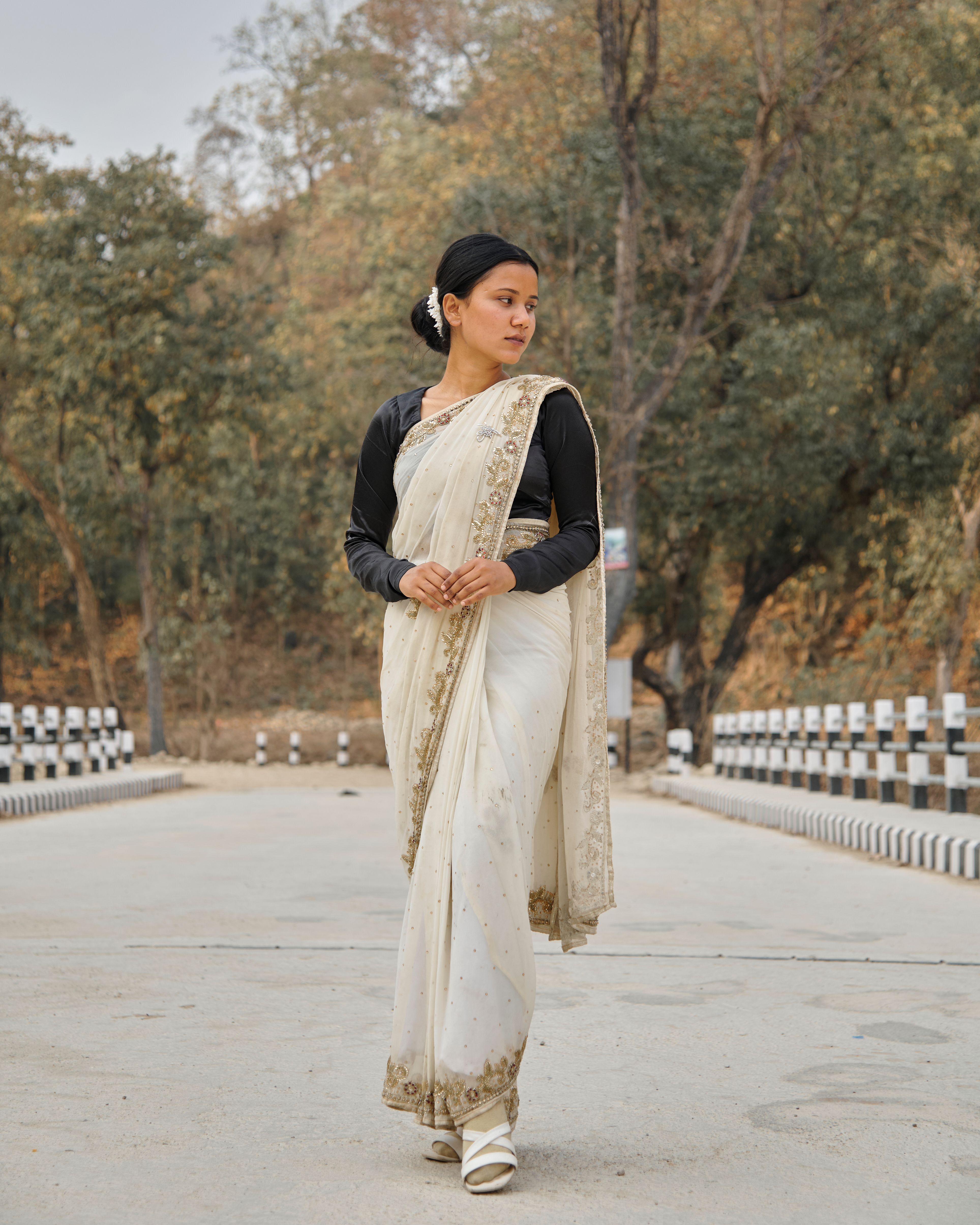 Young Woman in an Elegant Sari Standing in a Park · Free Stock Photo