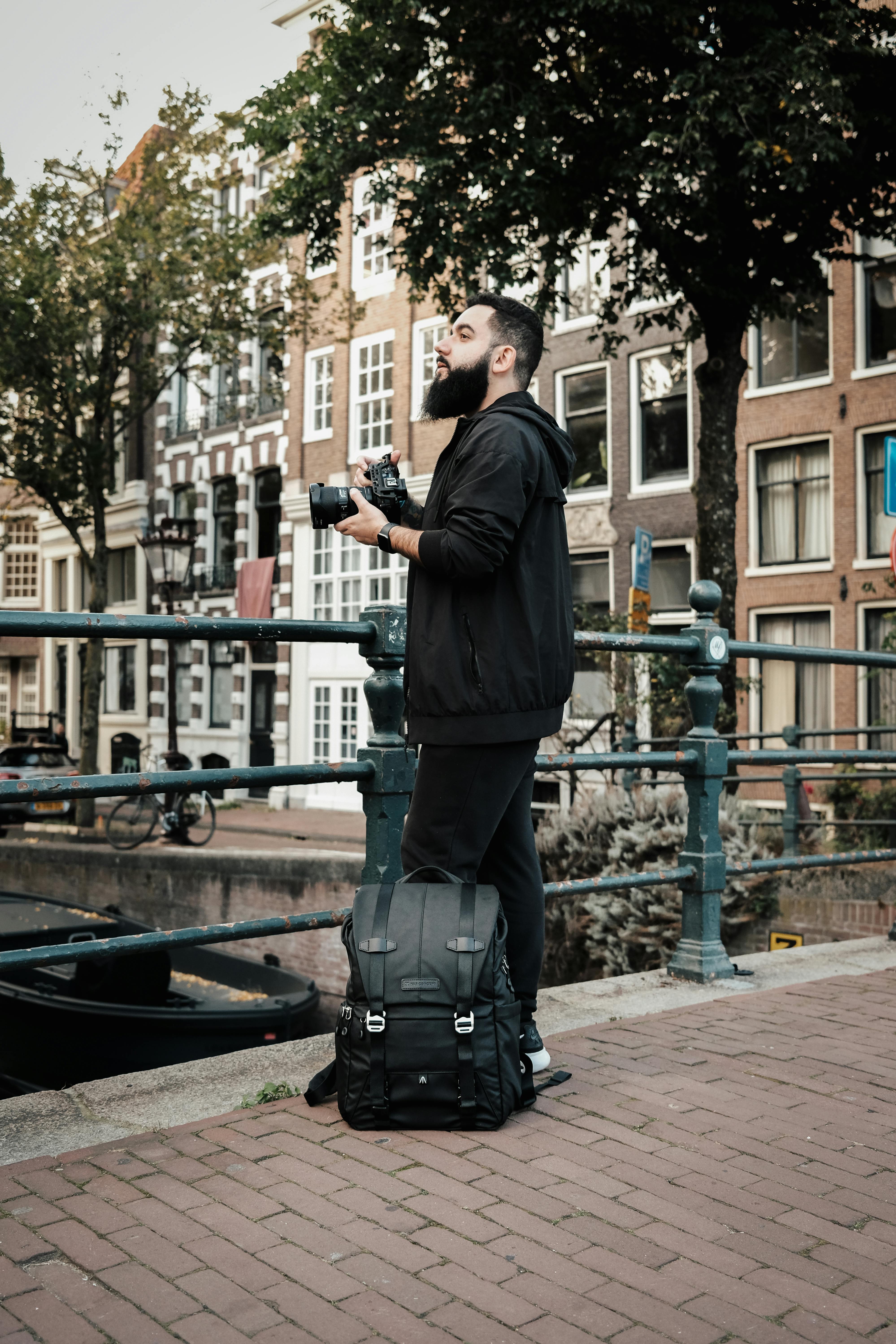 Man with Camera and Backpack · Free Stock Photo