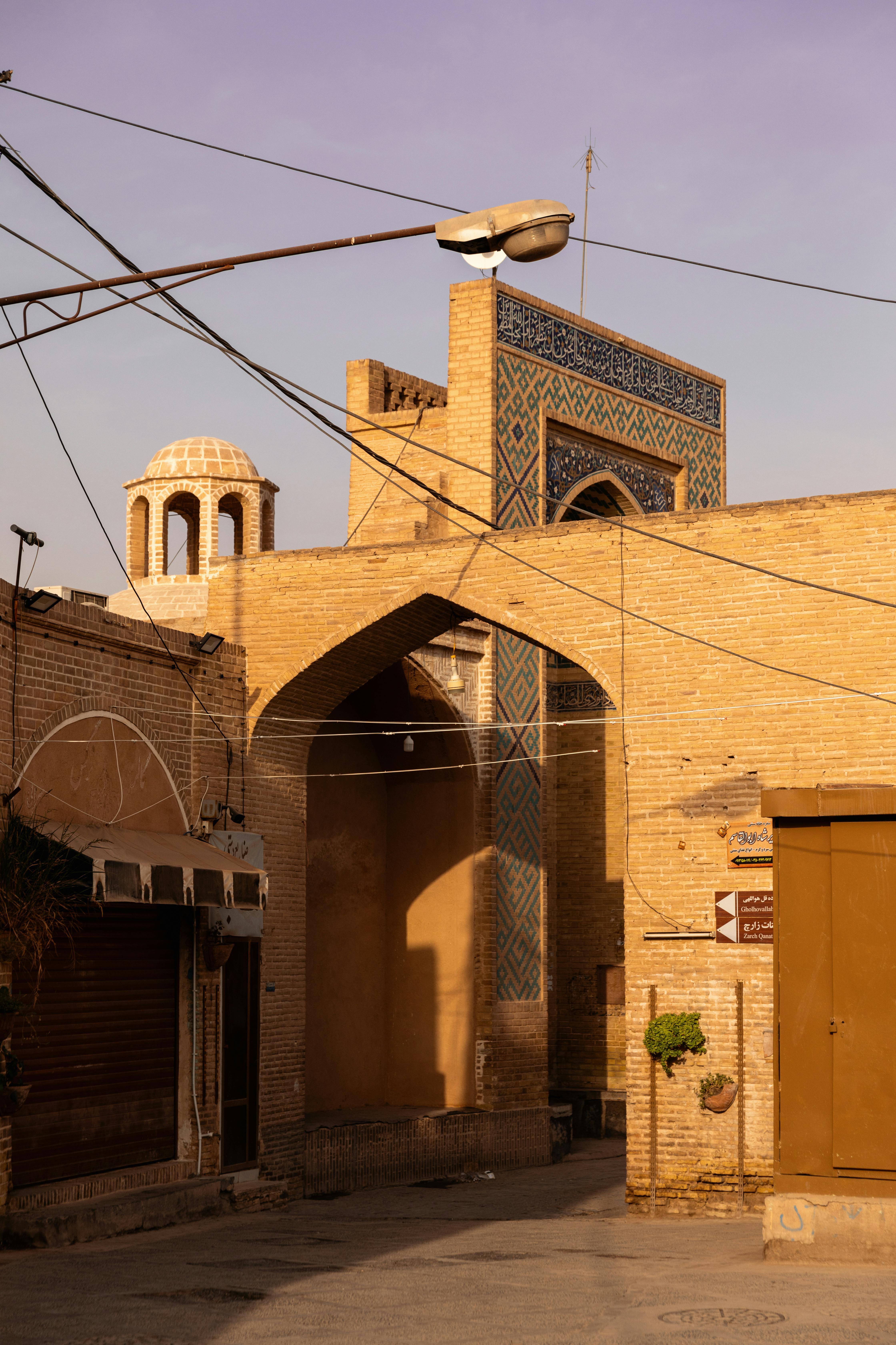 Power Lines around Gate in Town · Free Stock Photo