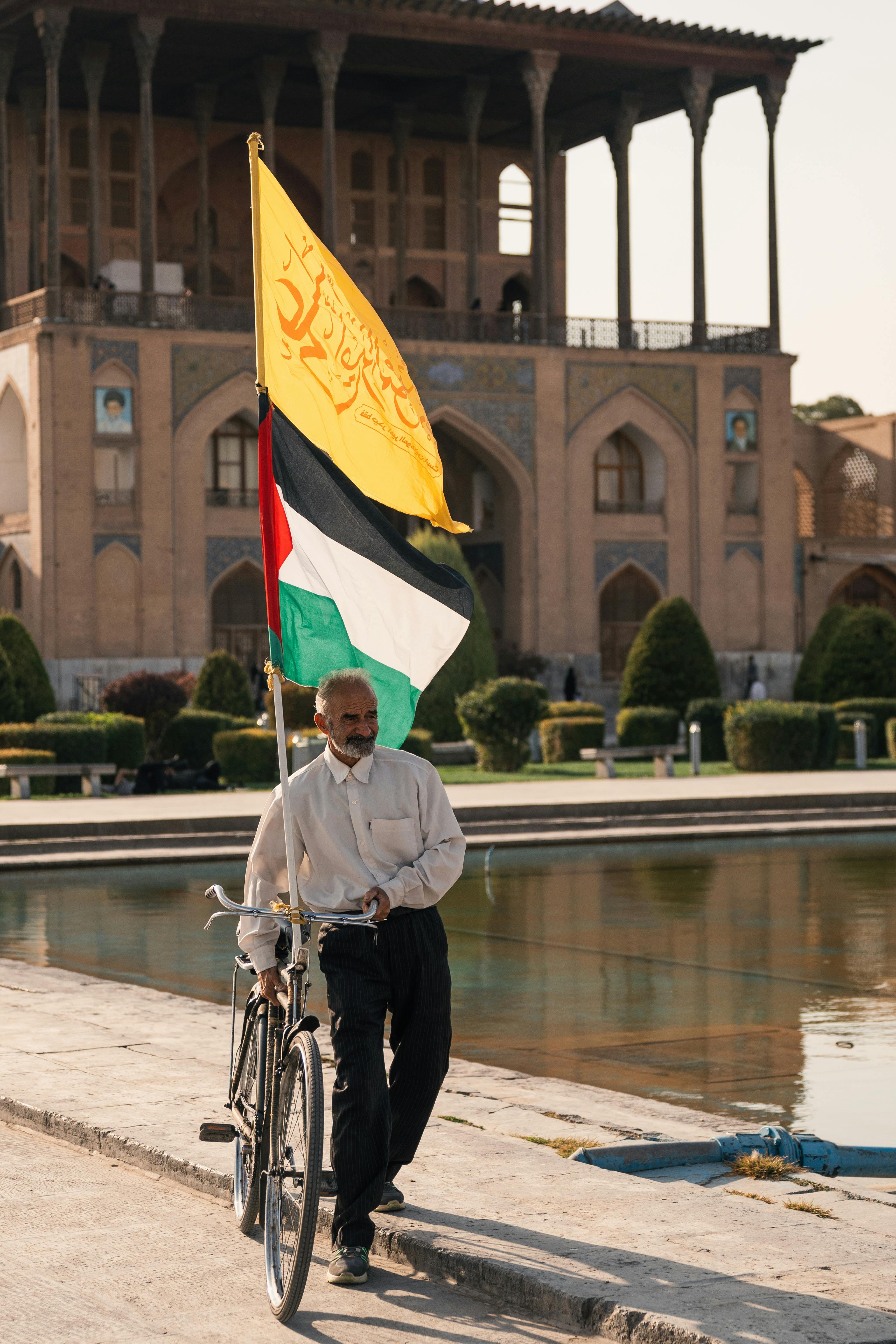 Man with Flag of Palestine at Aali Qapu Palace in Isfahan · Free Stock ...