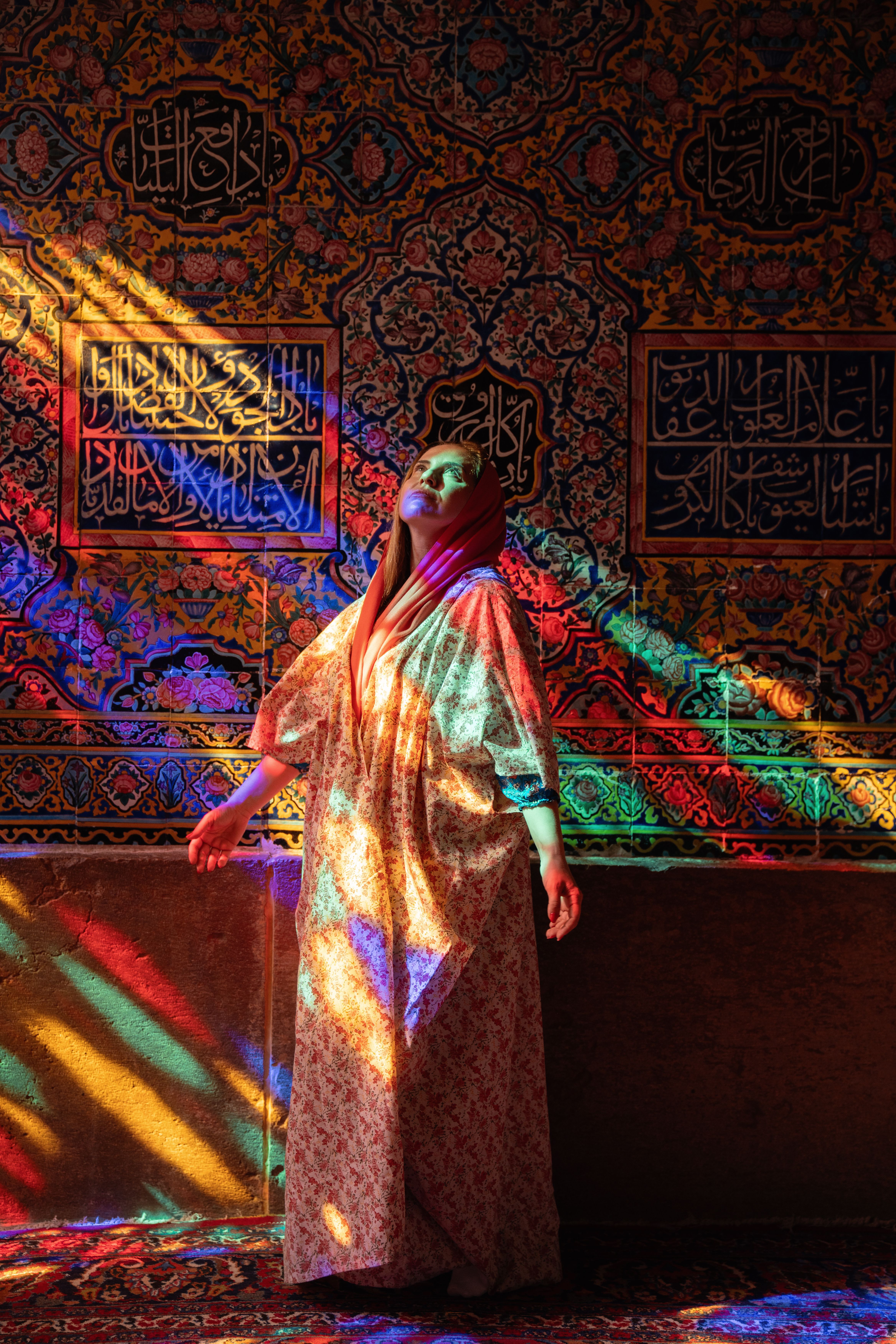 Colorful Light over Woman in Traditional Clothing at Mosque · Free ...
