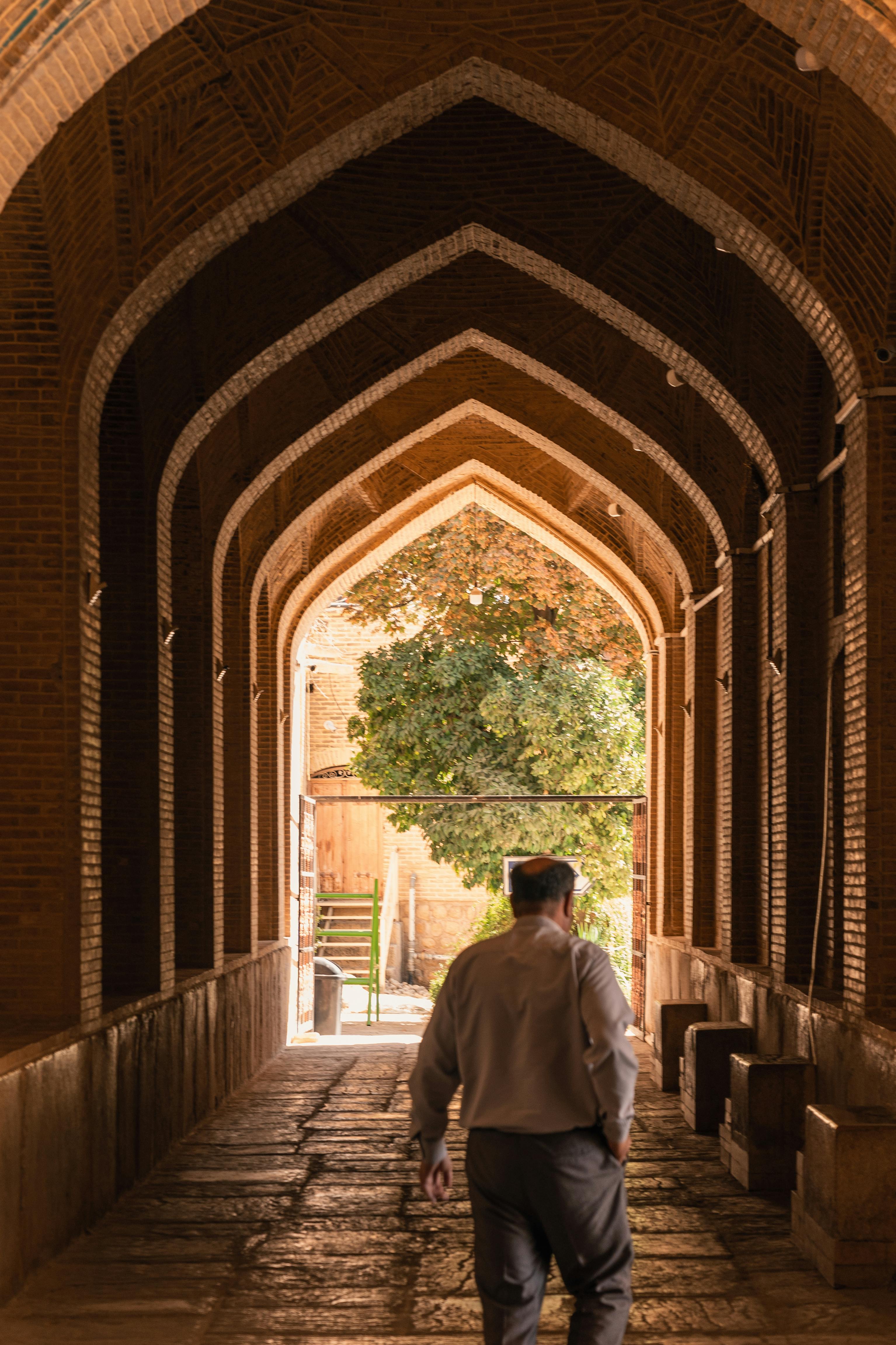 Man Standing Under Arch · Free Stock Photo