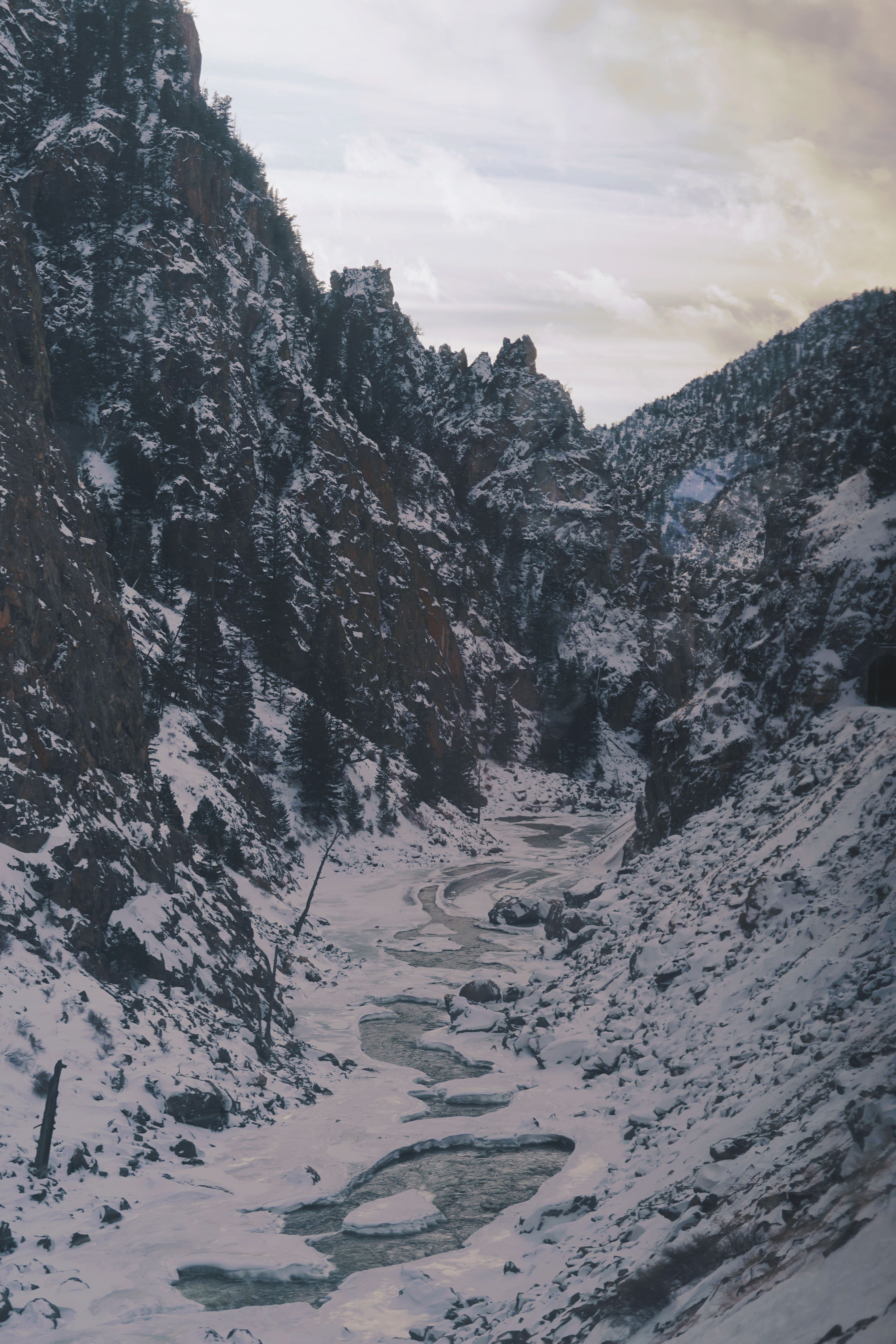 Frozen River in Valley in Mountains in Winter · Free Stock Photo