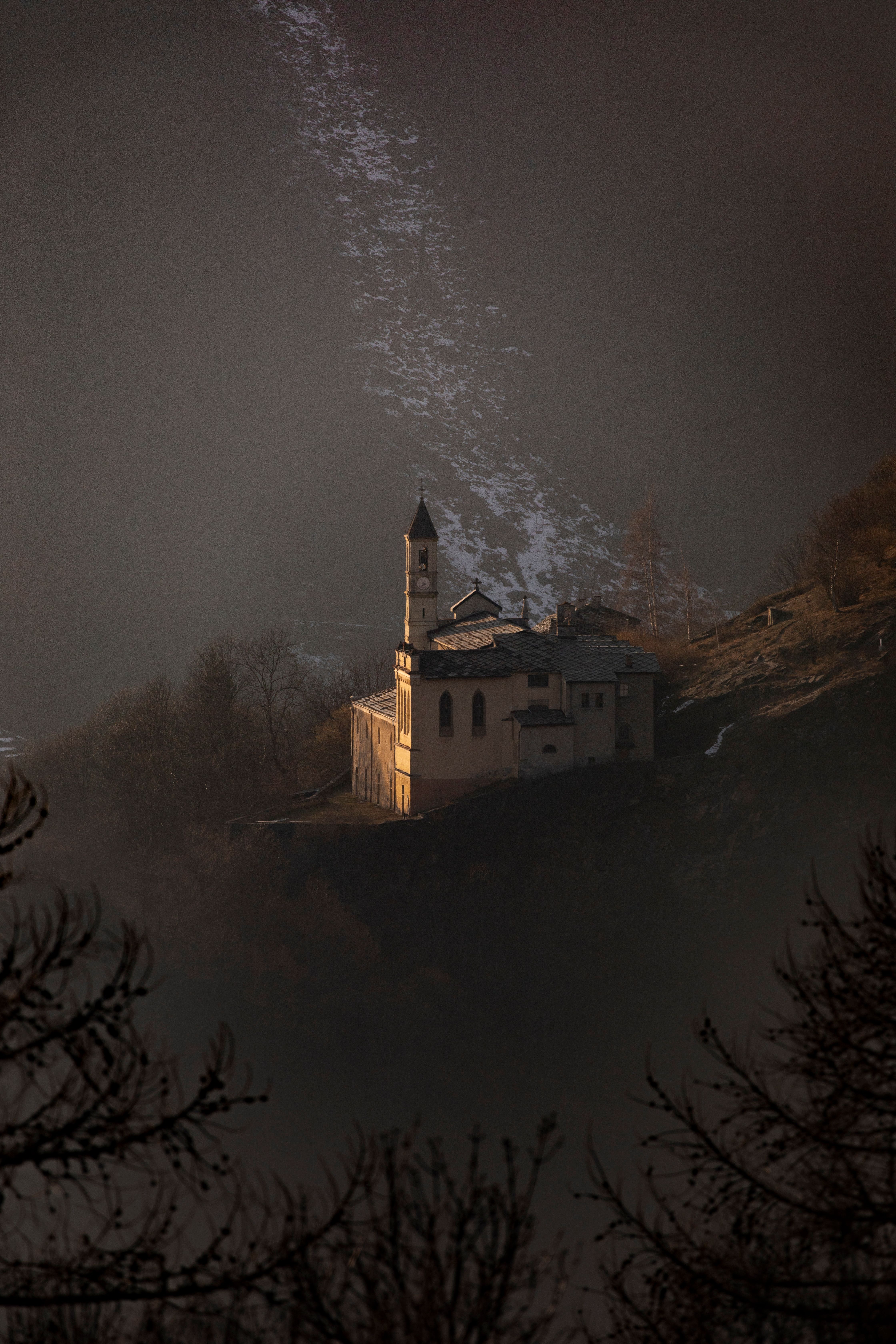 A church on top of a mountain in the fog · Free Stock Photo