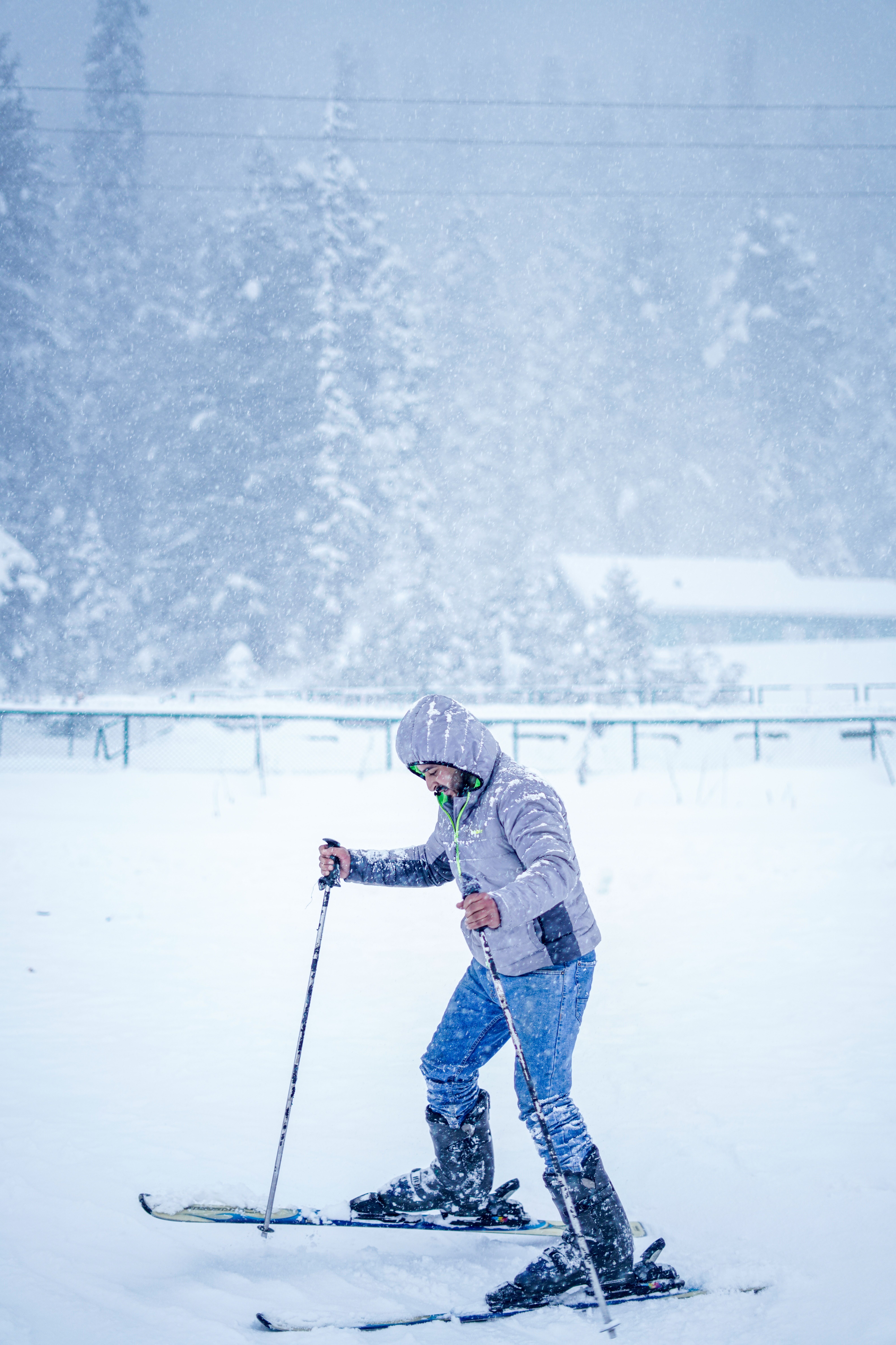 Person Cross Country Skiing while Snowing · Free Stock Photo