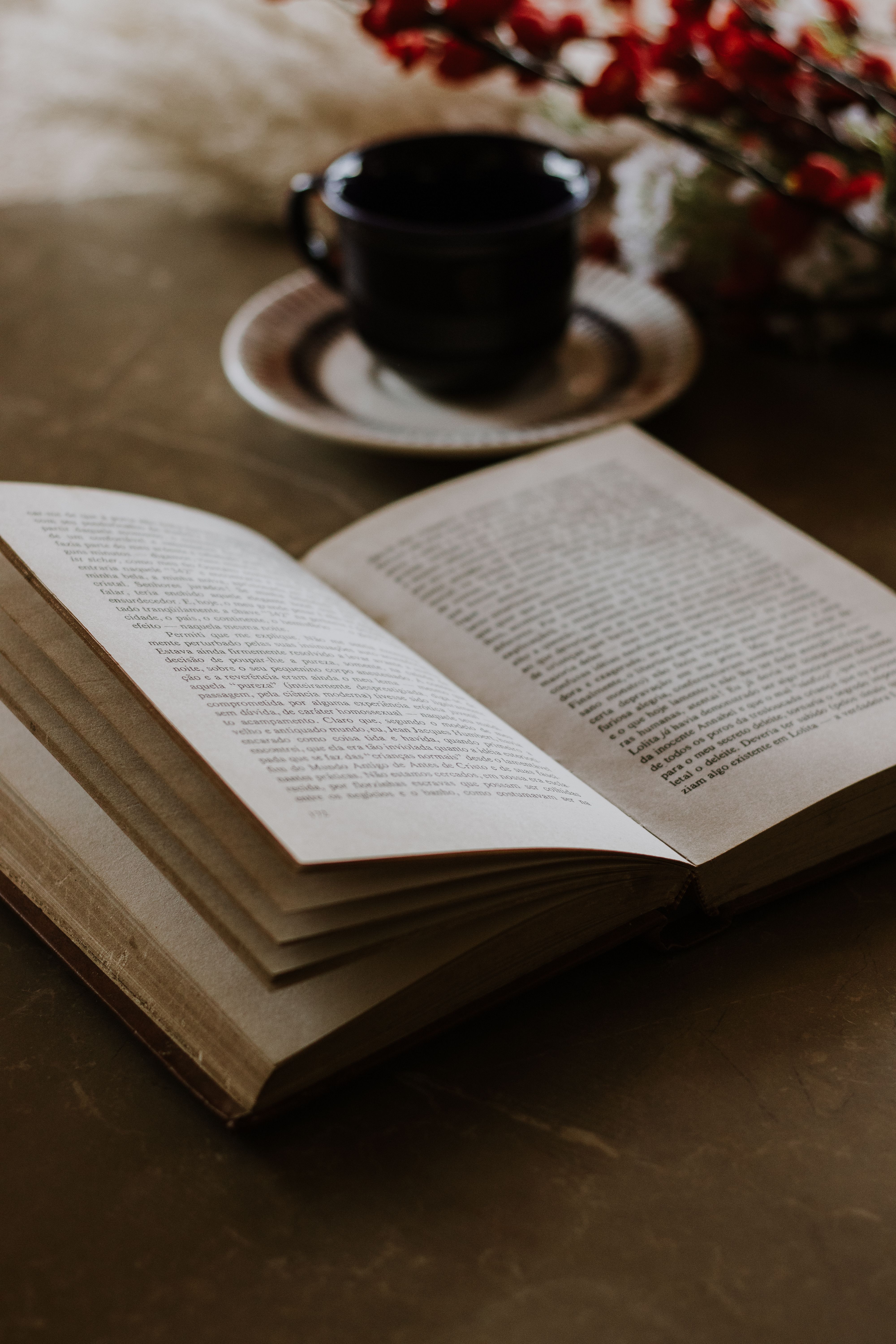 Open book on white table in library · Free Stock Photo