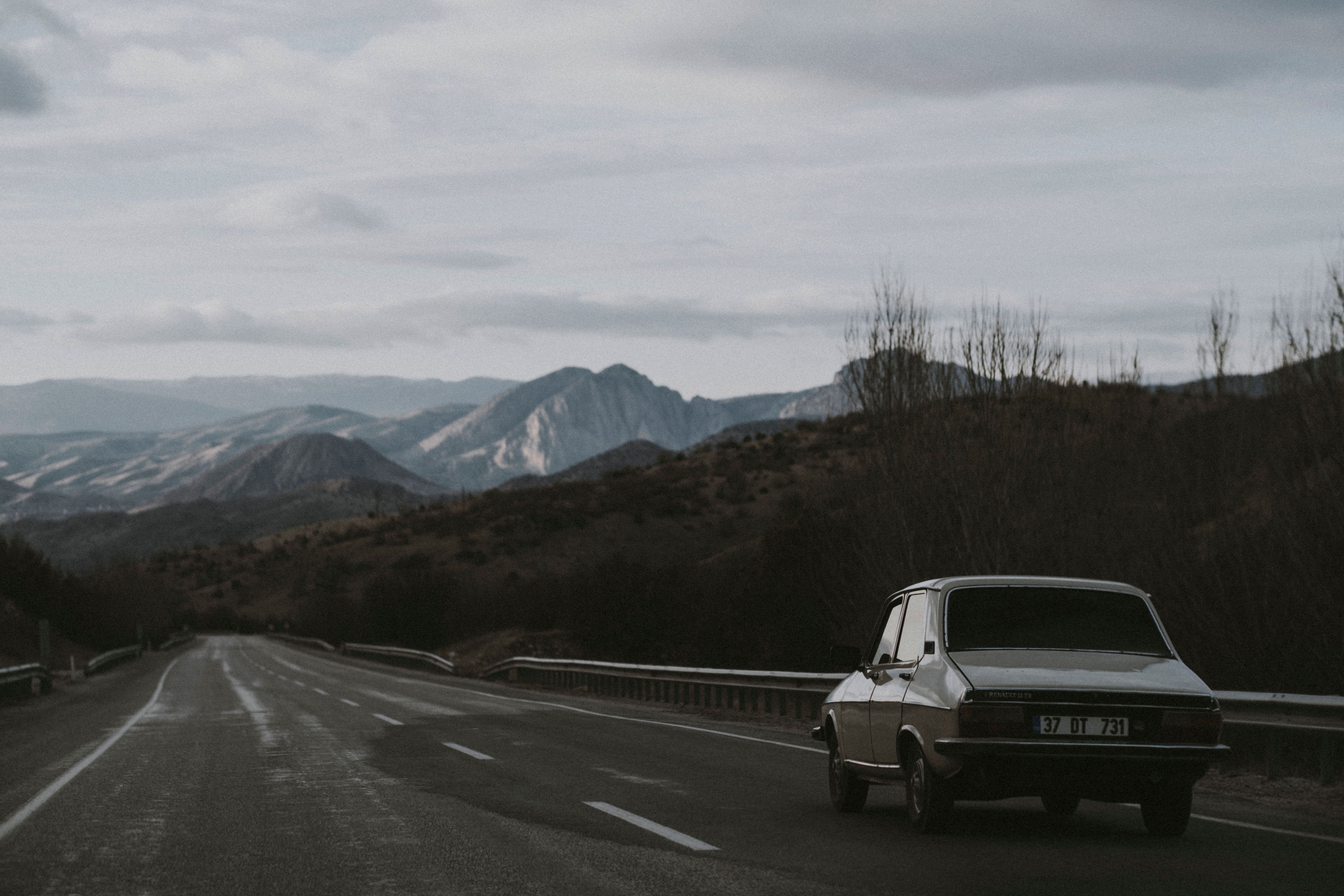 Lada is Driving on Road to Mountains · Free Stock Photo