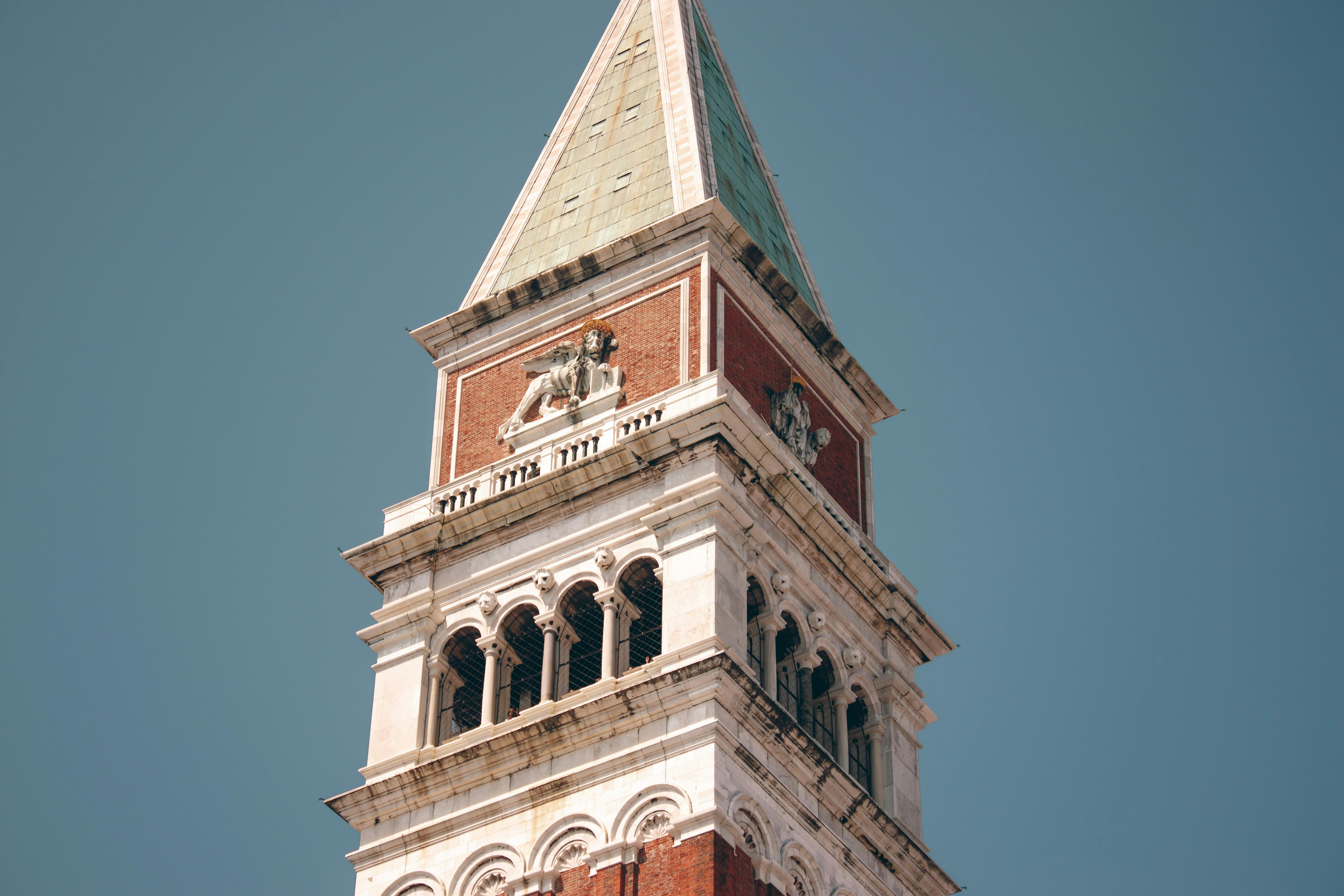 A tall tower with a clock on top · Free Stock Photo