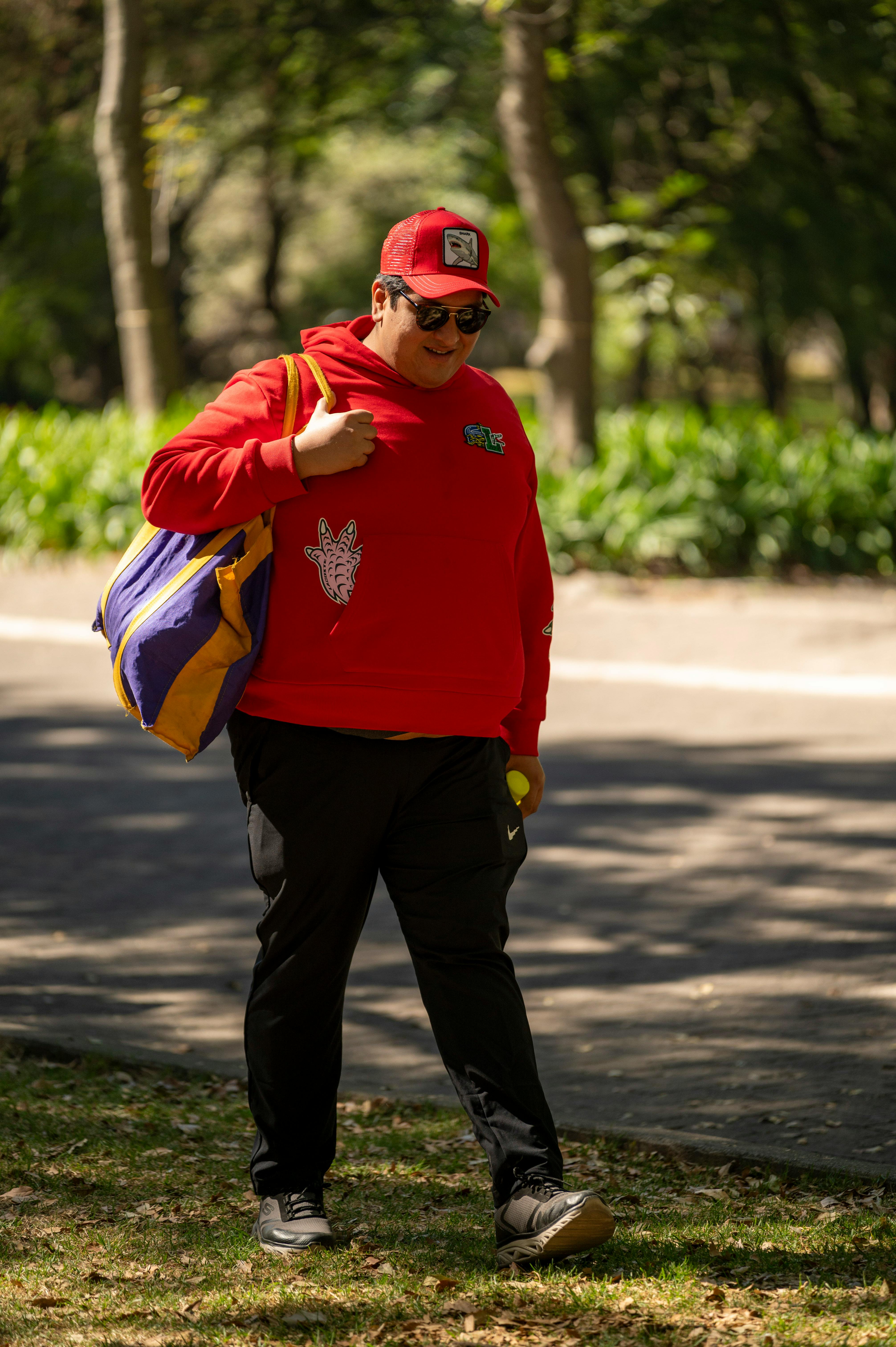 Man Wearing Red Jacket in a Park · Free Stock Photo