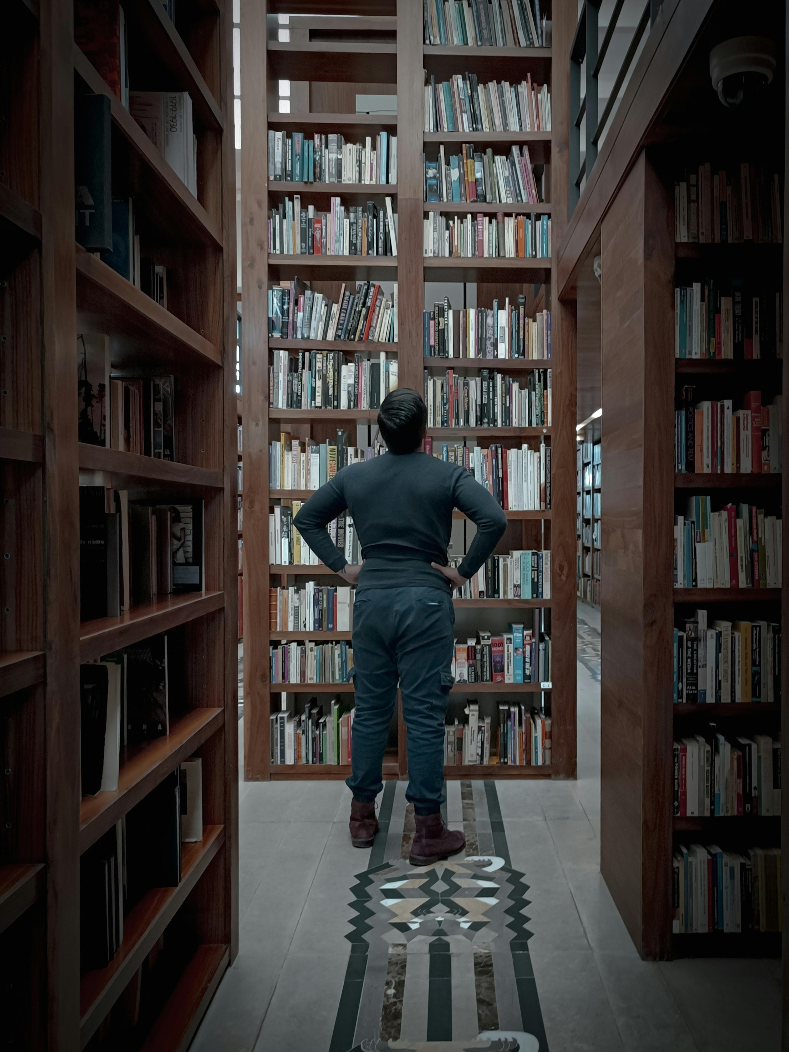Back View of Man at Library · Free Stock Photo