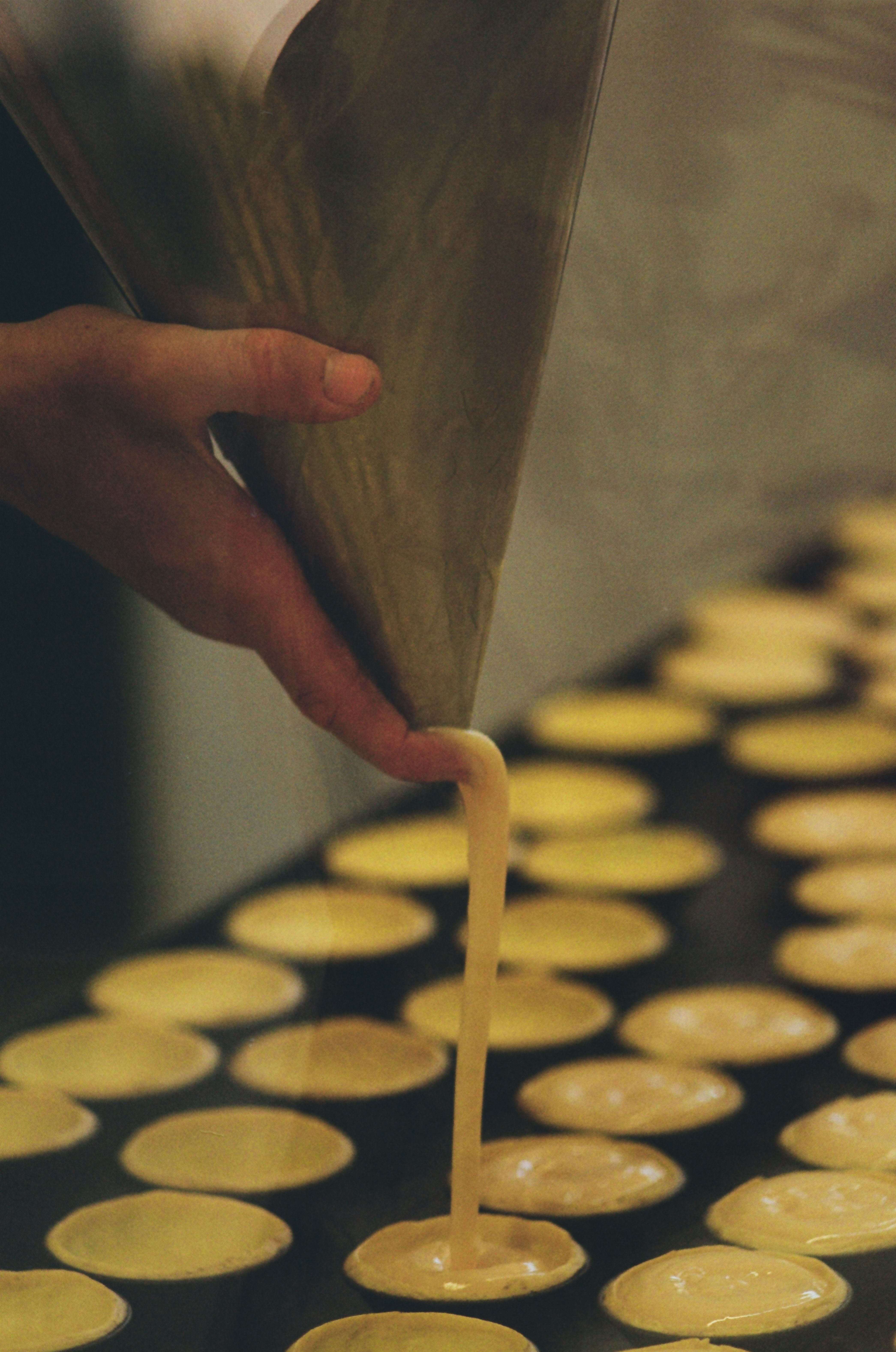 Pouring Dough on Table and Preparing Food · Free Stock Photo