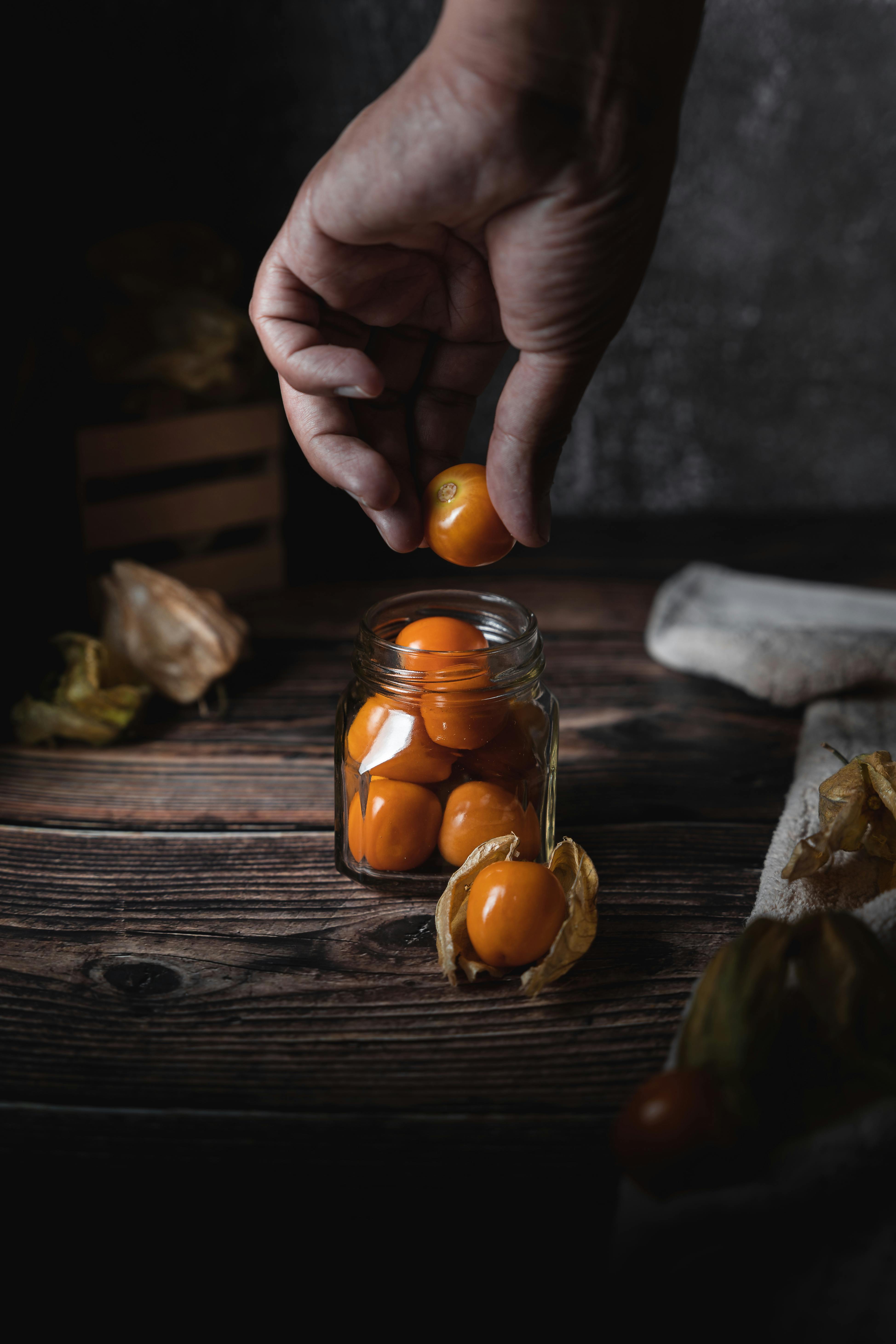 Man Hand over Jar with Fruit · Free Stock Photo