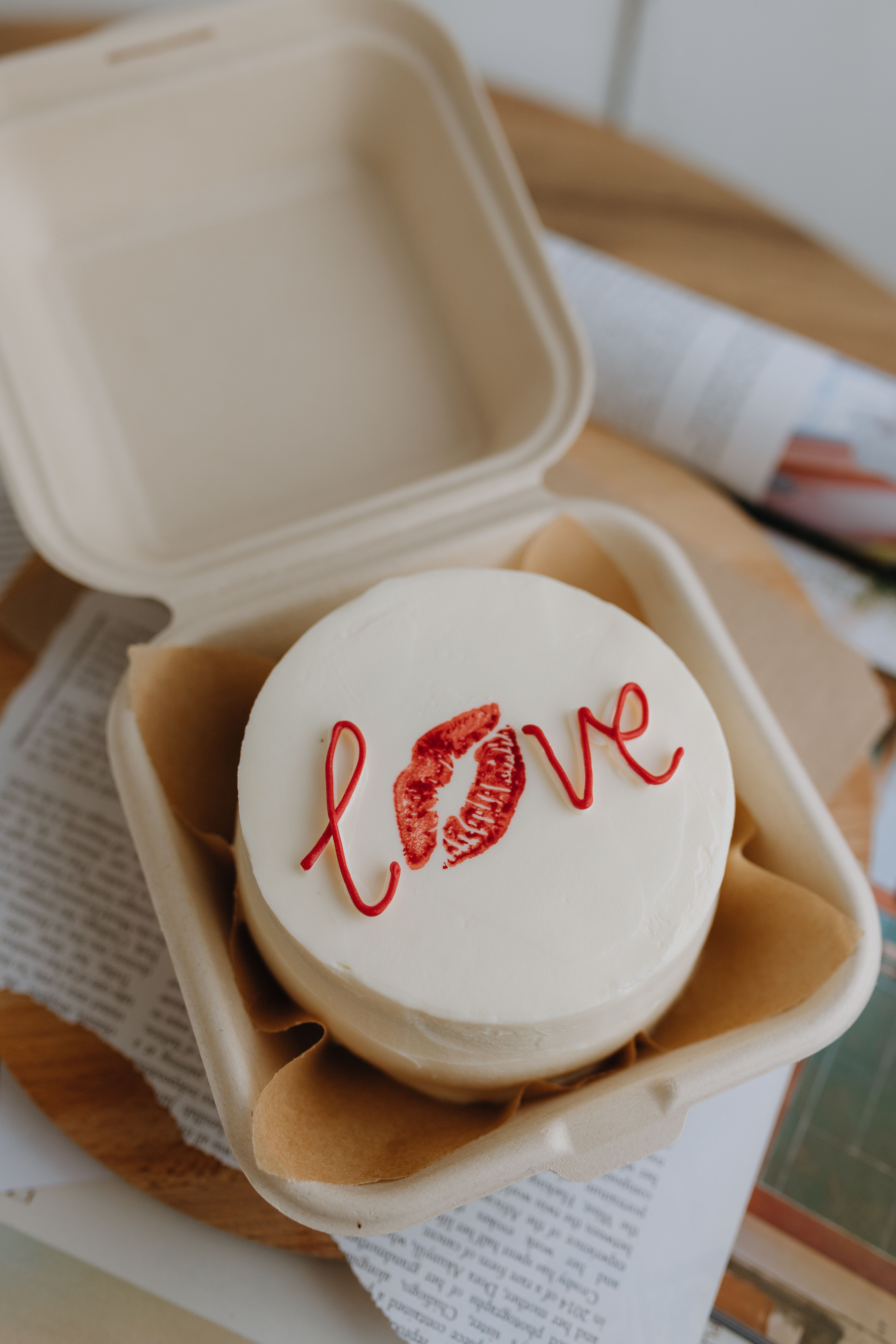 White Cake with Red Design in a Box · Free Stock Photo