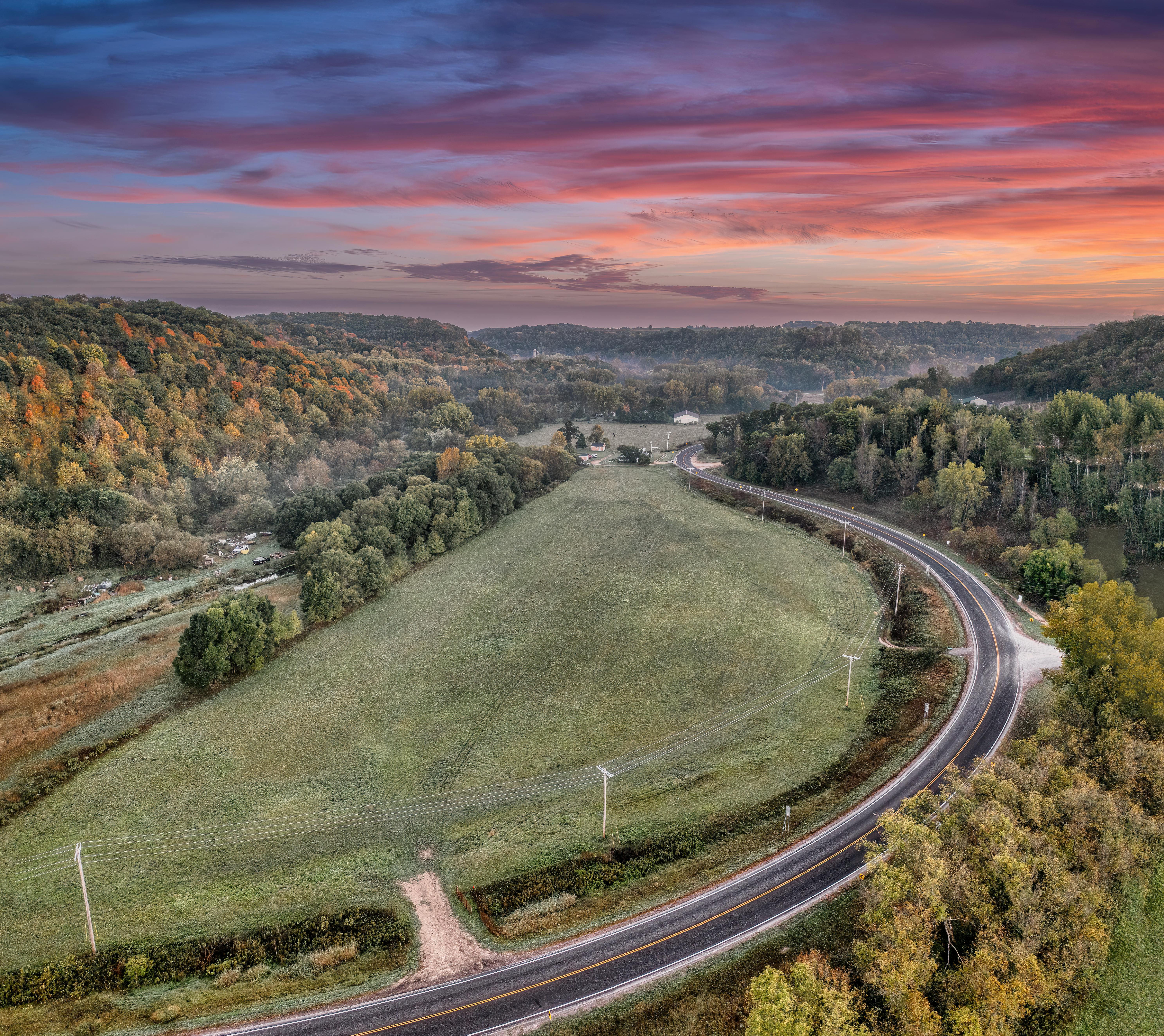 Aerial View of a Road, Fields and Trees under a Dramatic Sunset Sky ...