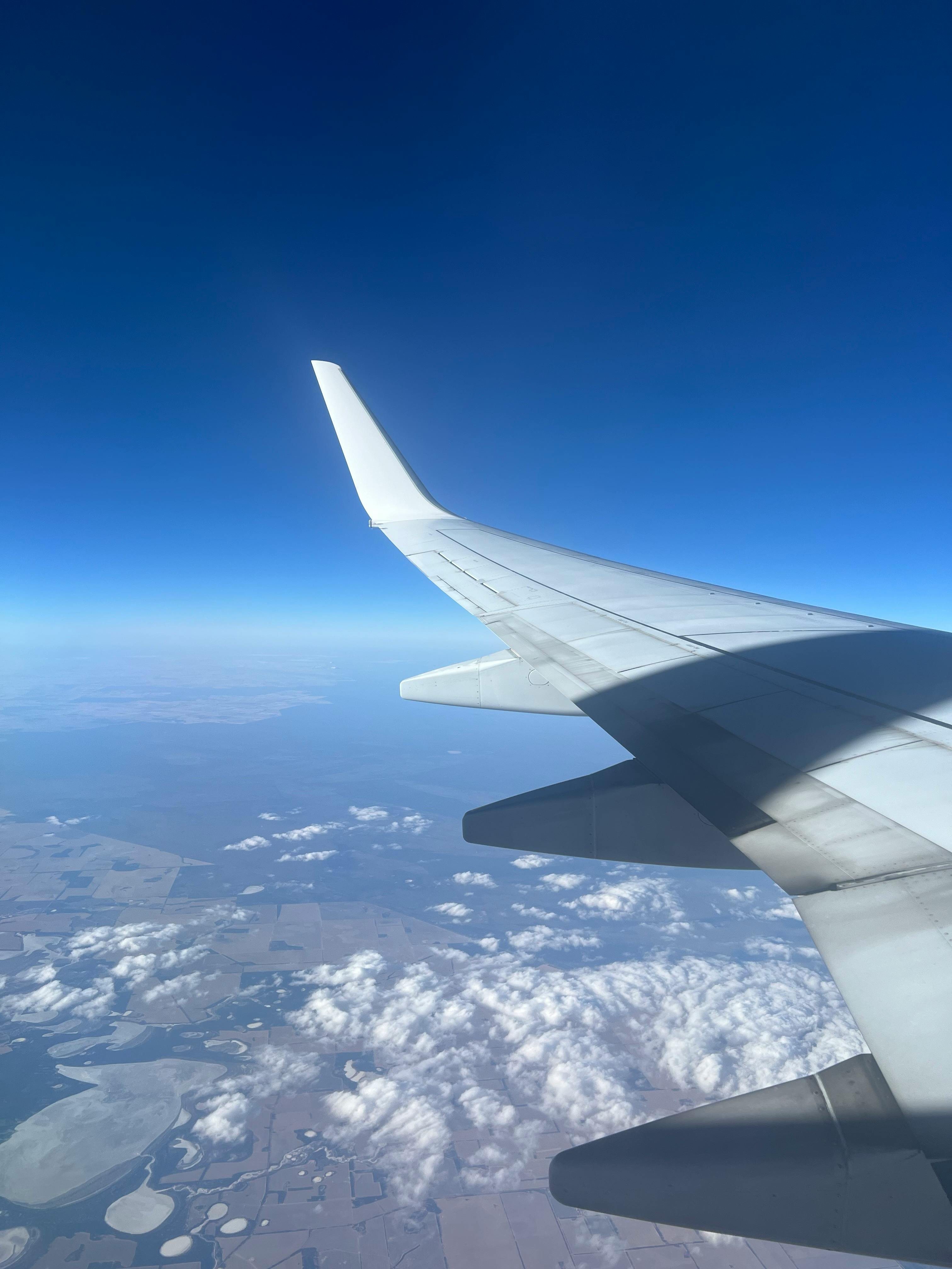 Wing of Flying Airplane · Free Stock Photo