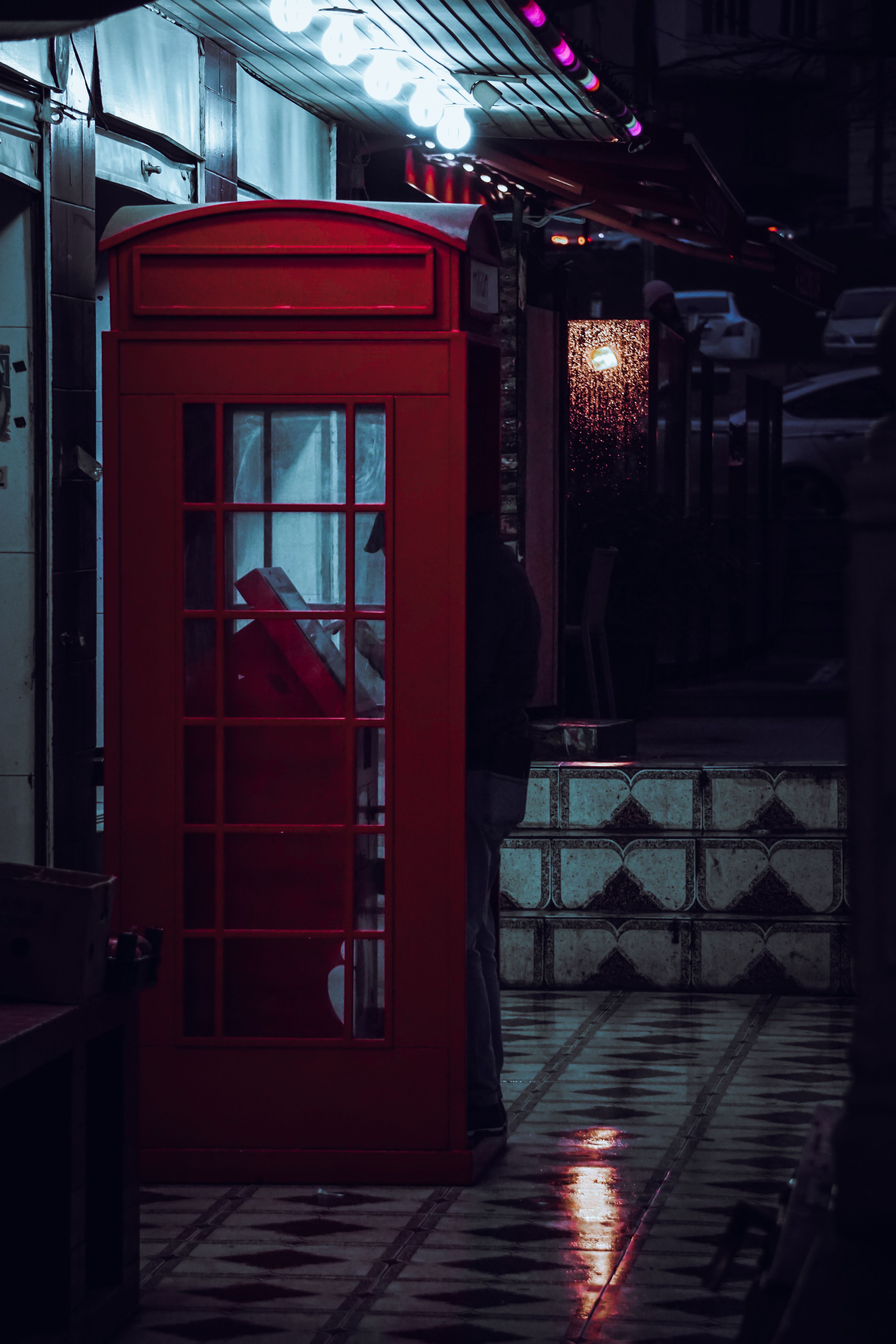 Man at Telephone Booth at Night · Free Stock Photo
