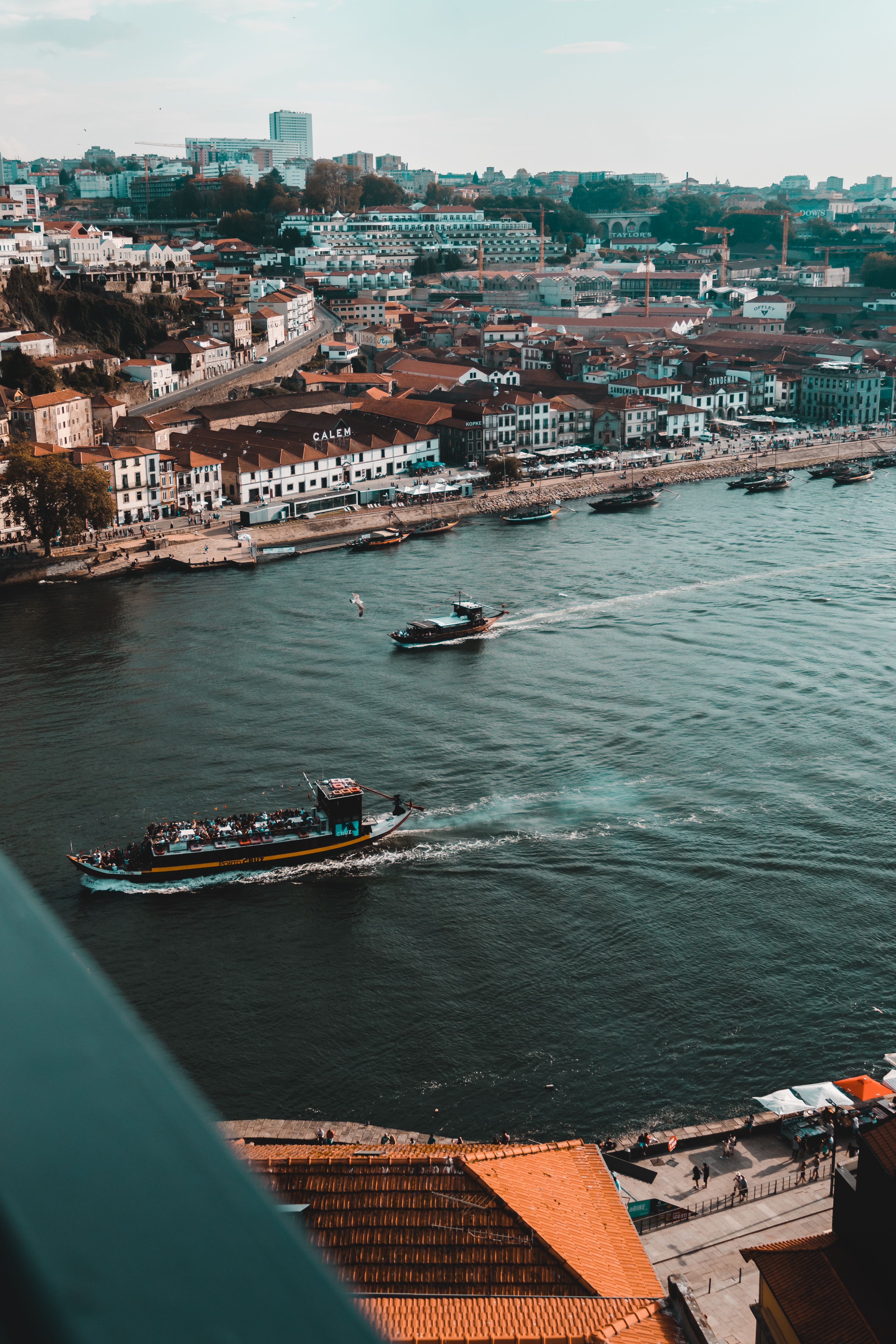 Boats on a River and Buildings in City Seen from a Bridge · Free Stock ...