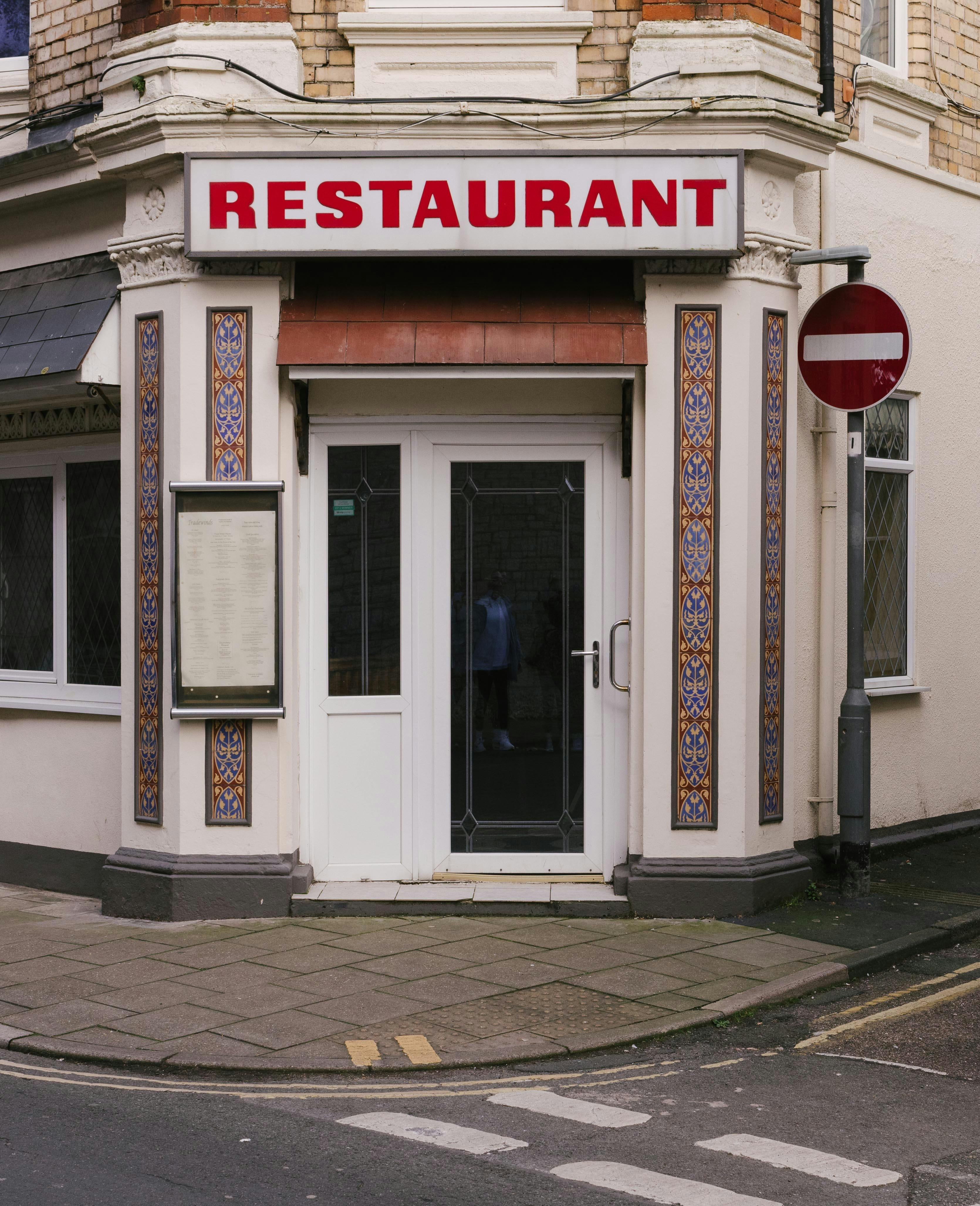 Restaurant Entrance Door on the Street Corner in UK · Free Stock Photo