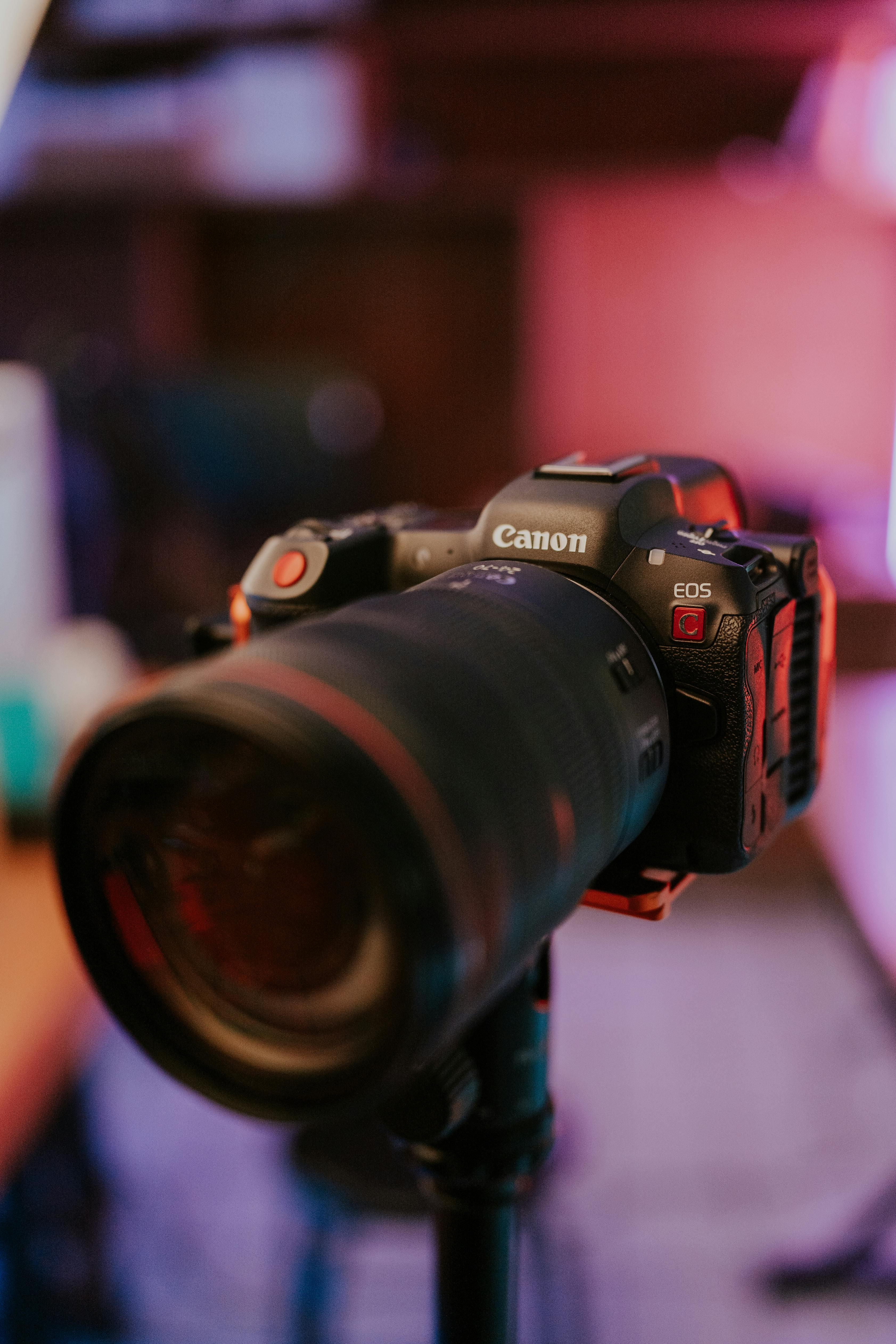 Canon EOS R5 C Camera with Lens on a Tripod · Free Stock Photo