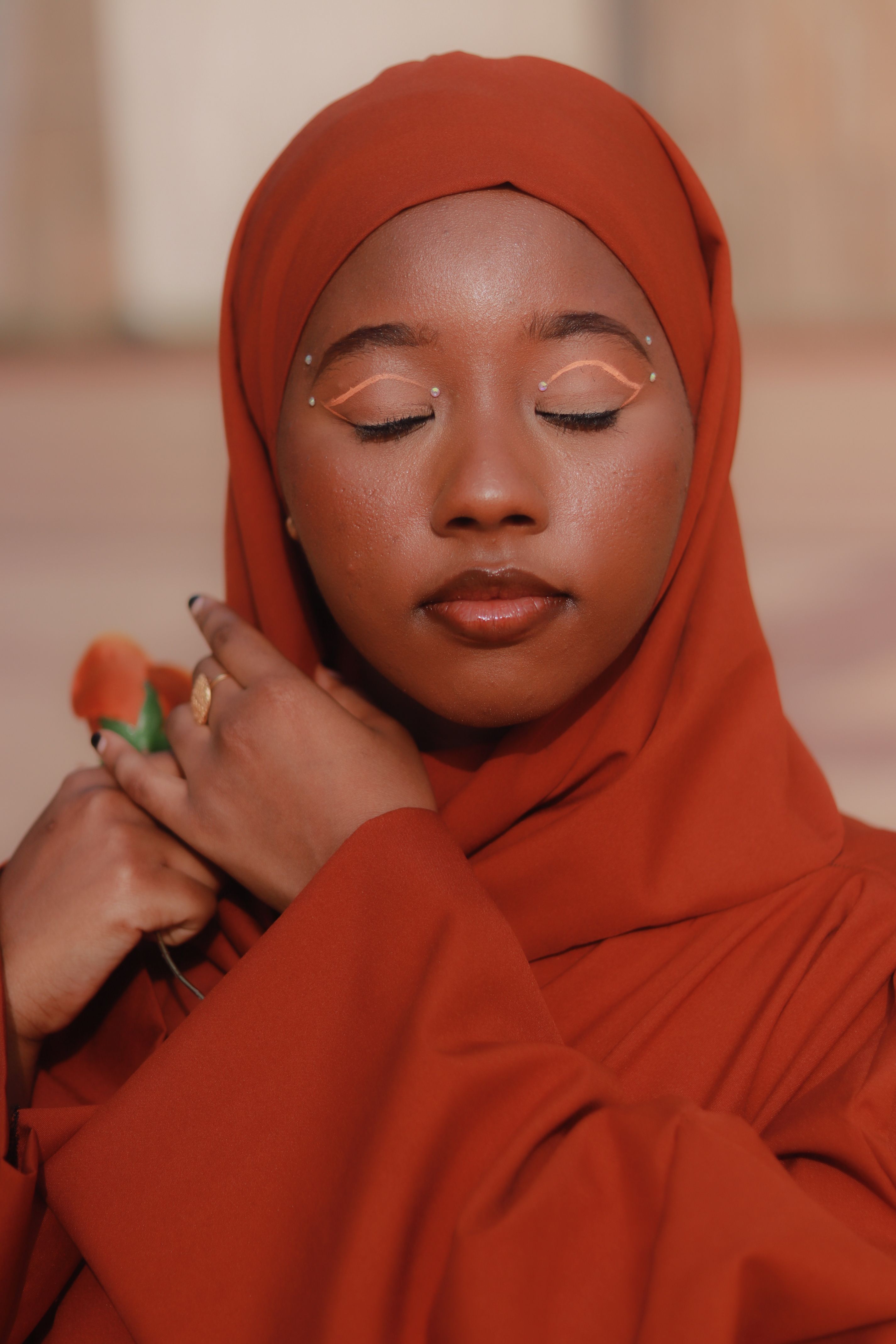 Elegant Portrait of Woman in Red Hijab with Makeup · Free Stock Photo