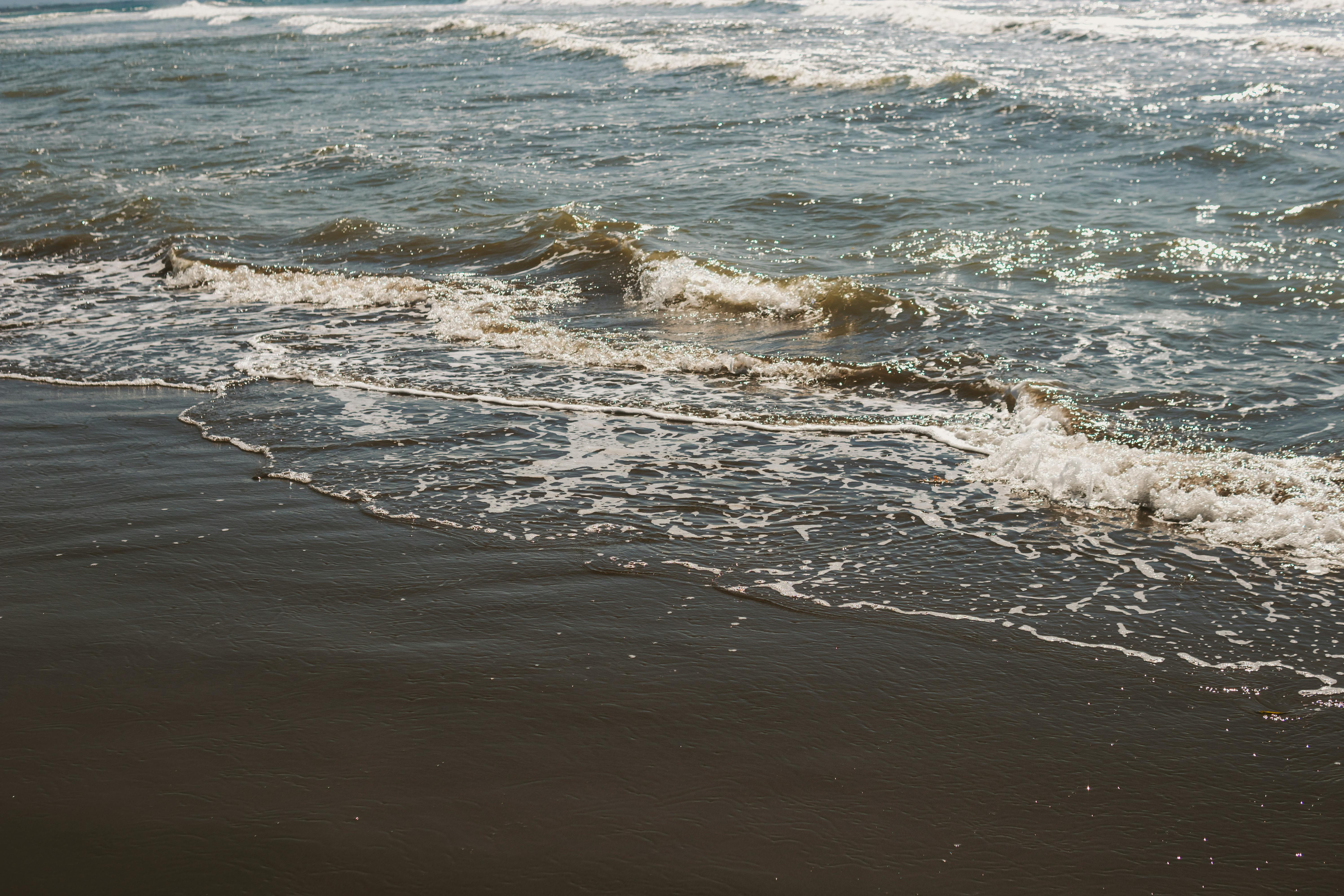 Close-up of Sea Water Washing Over the Beach · Free Stock Photo