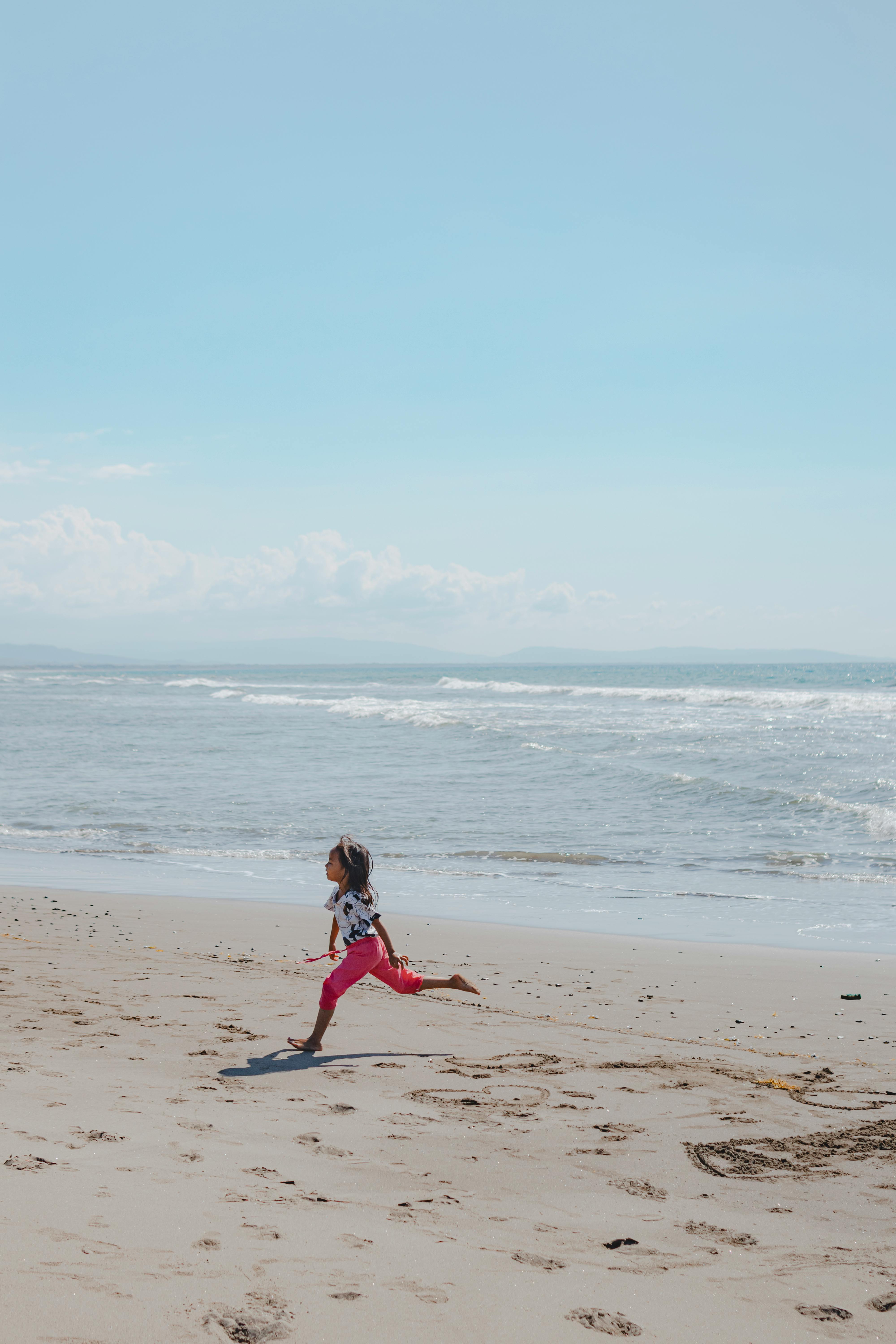 Girl Running on Beach · Free Stock Photo