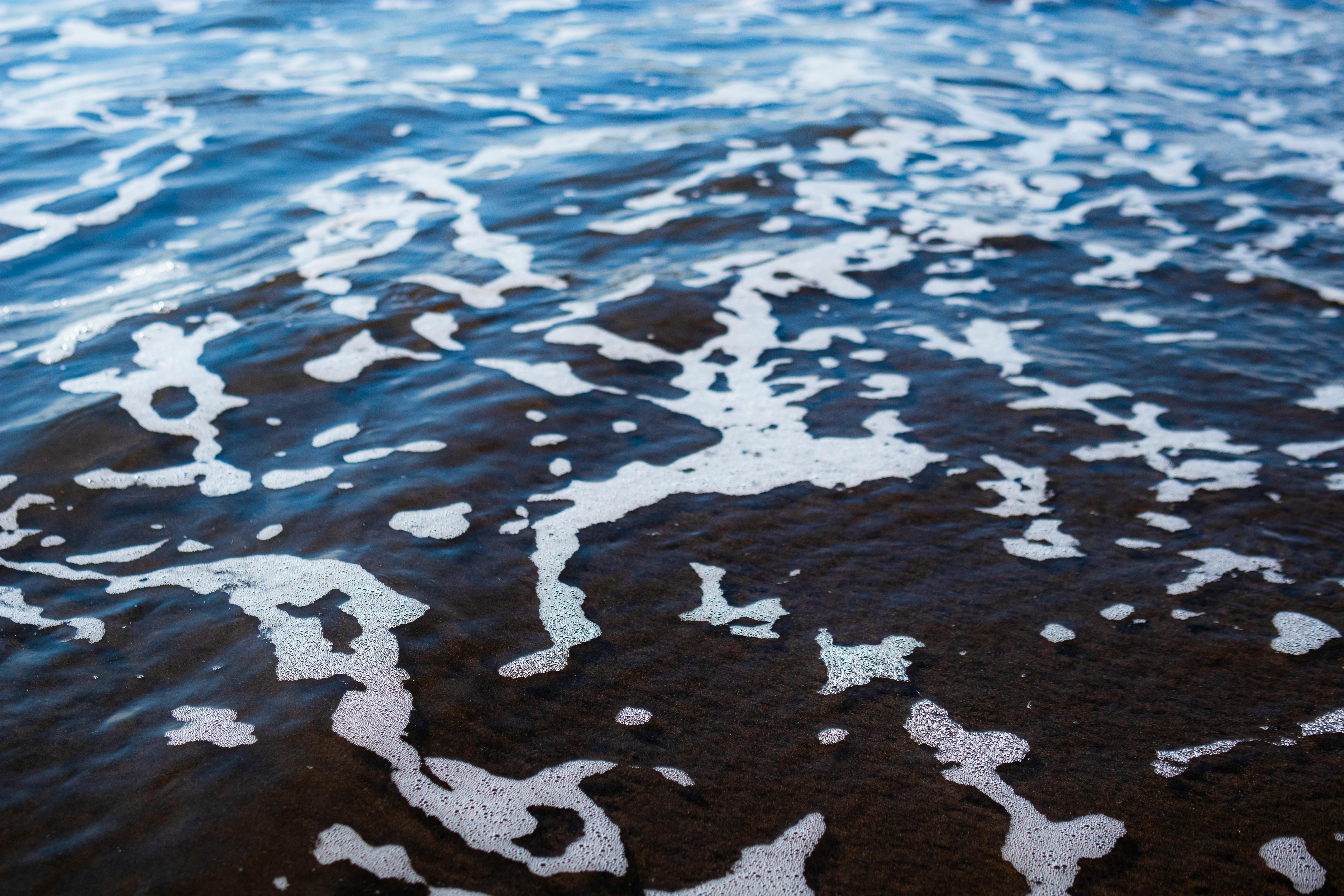Sea Water Forming Seafoams · Free Stock Photo