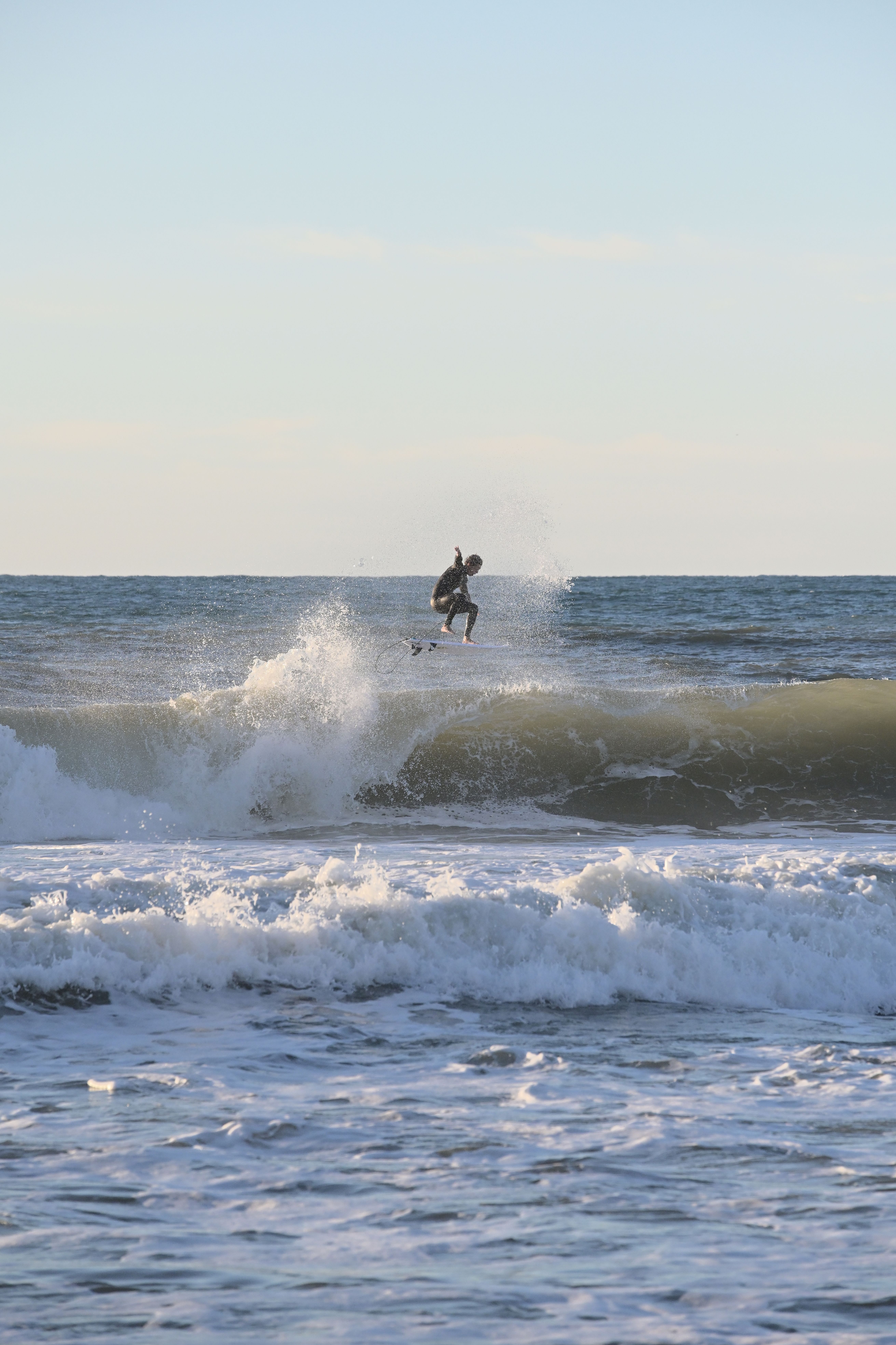 Man Surfing on Body of Water · Free Stock Photo