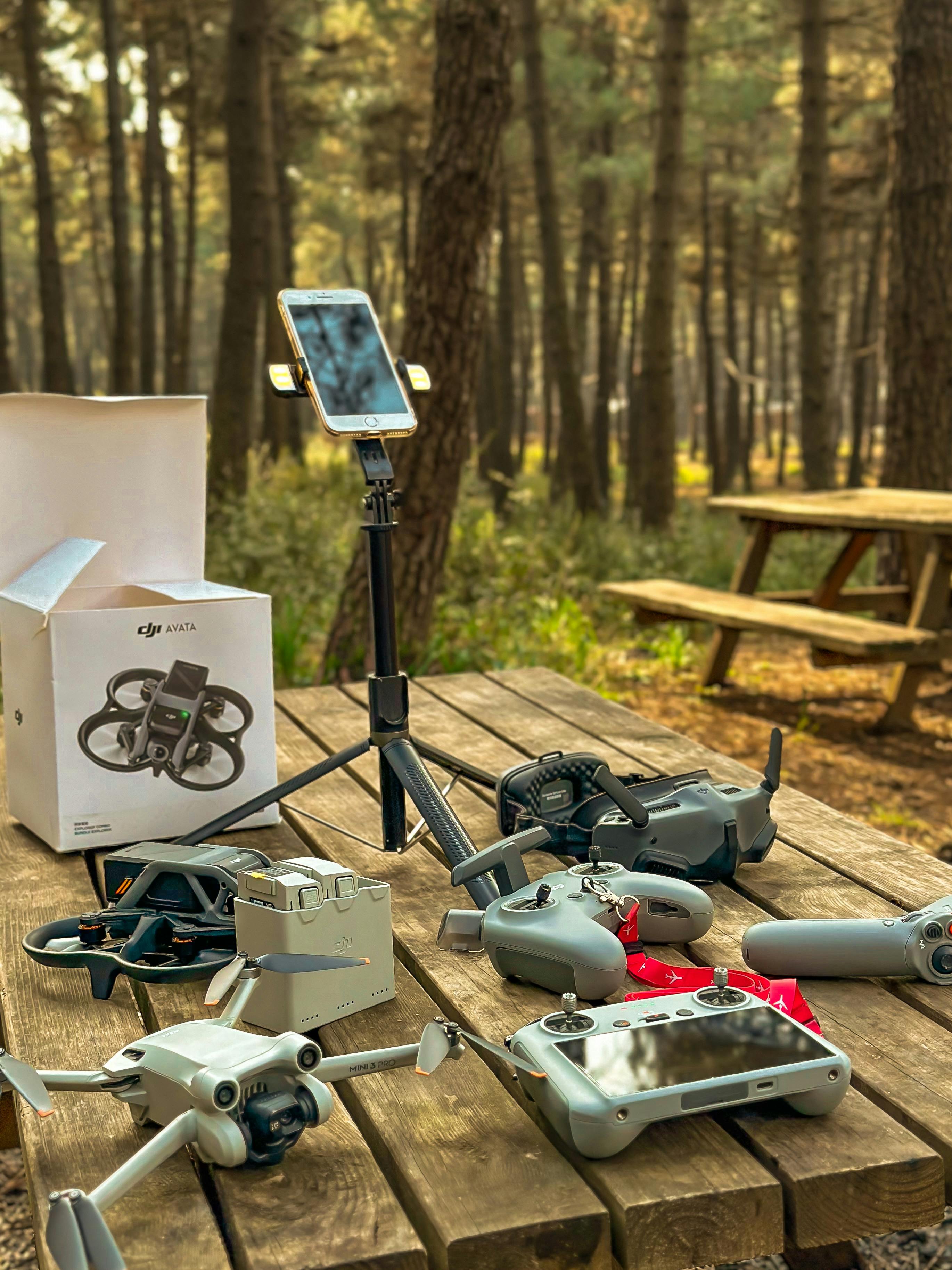 Drone Equipment and Smartphone on a Tripod Standing on a Bench in a ...