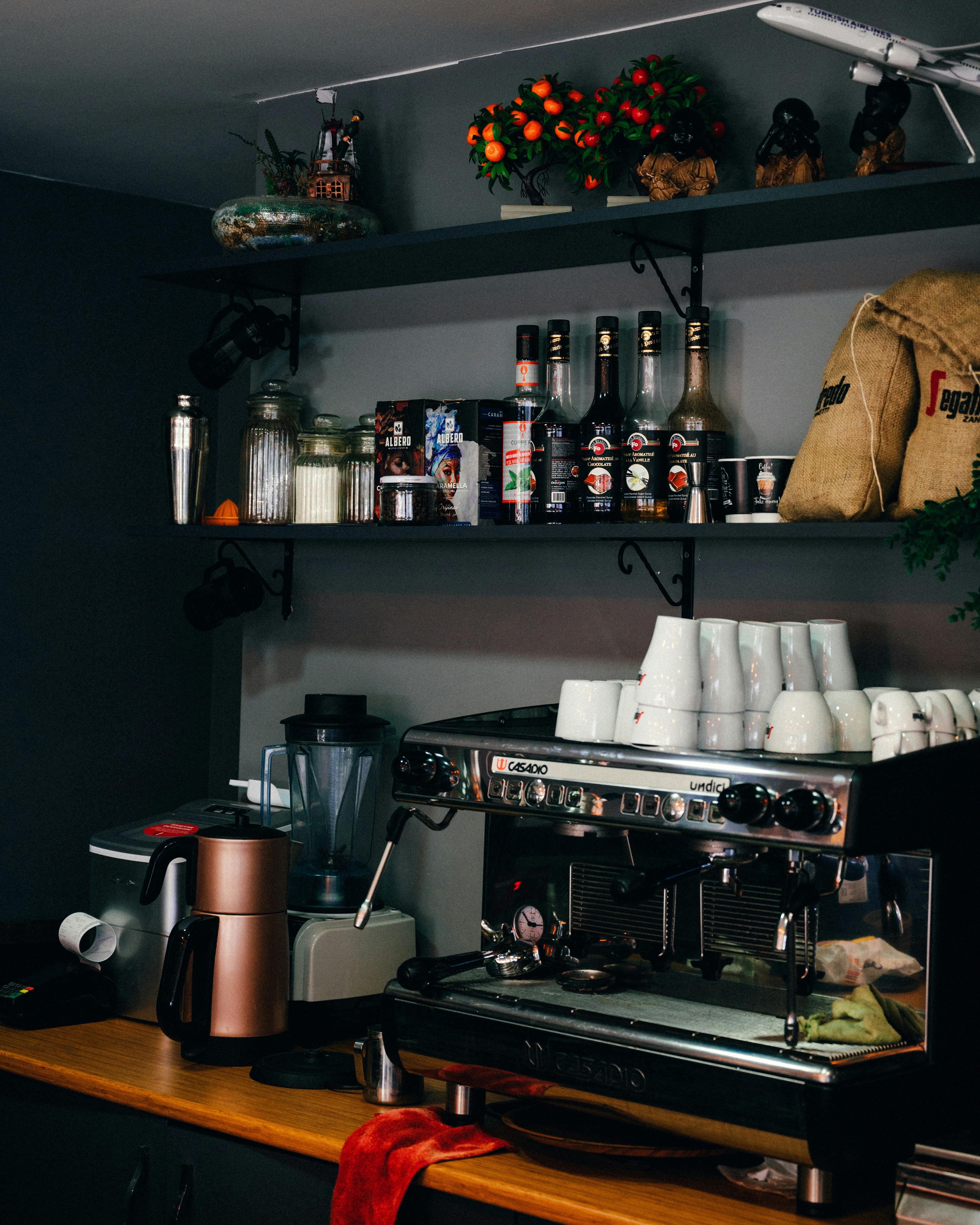 A coffee machine is on a shelf in a kitchen · Free Stock Photo