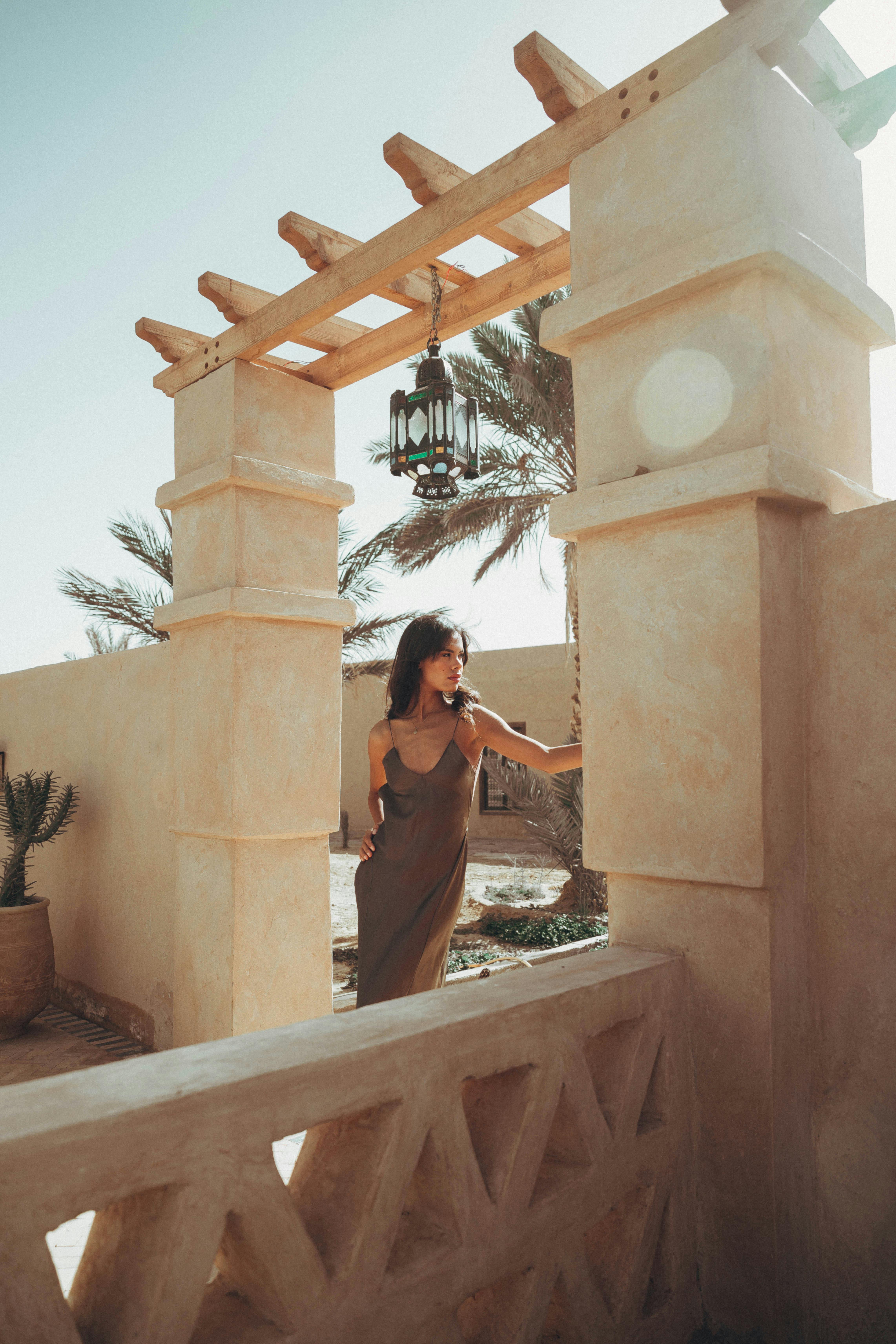 Model in Spaghetti Strap Dress Standing in Corner · Free Stock Photo