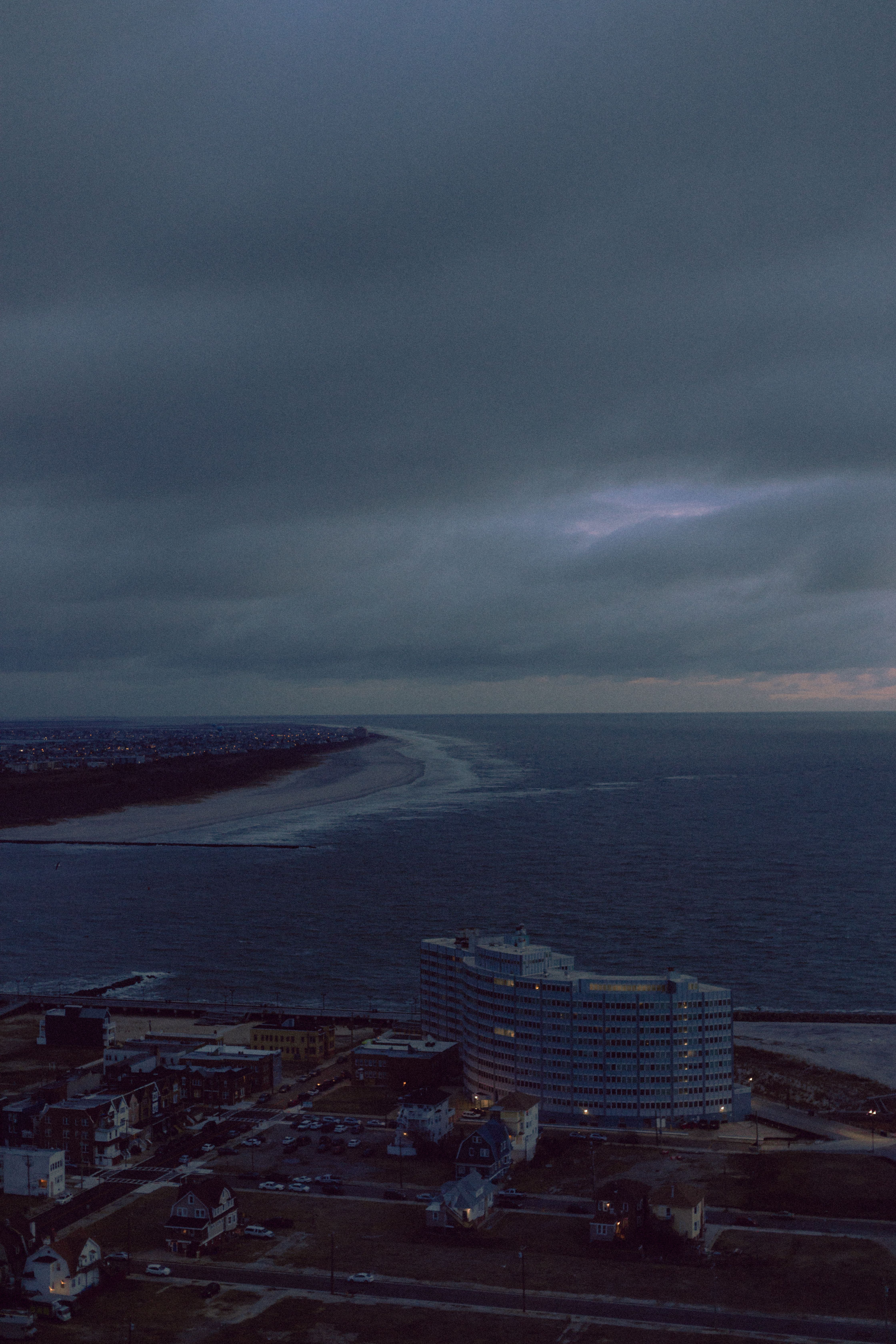 Rain Cloud over City on Sea Coast · Free Stock Photo