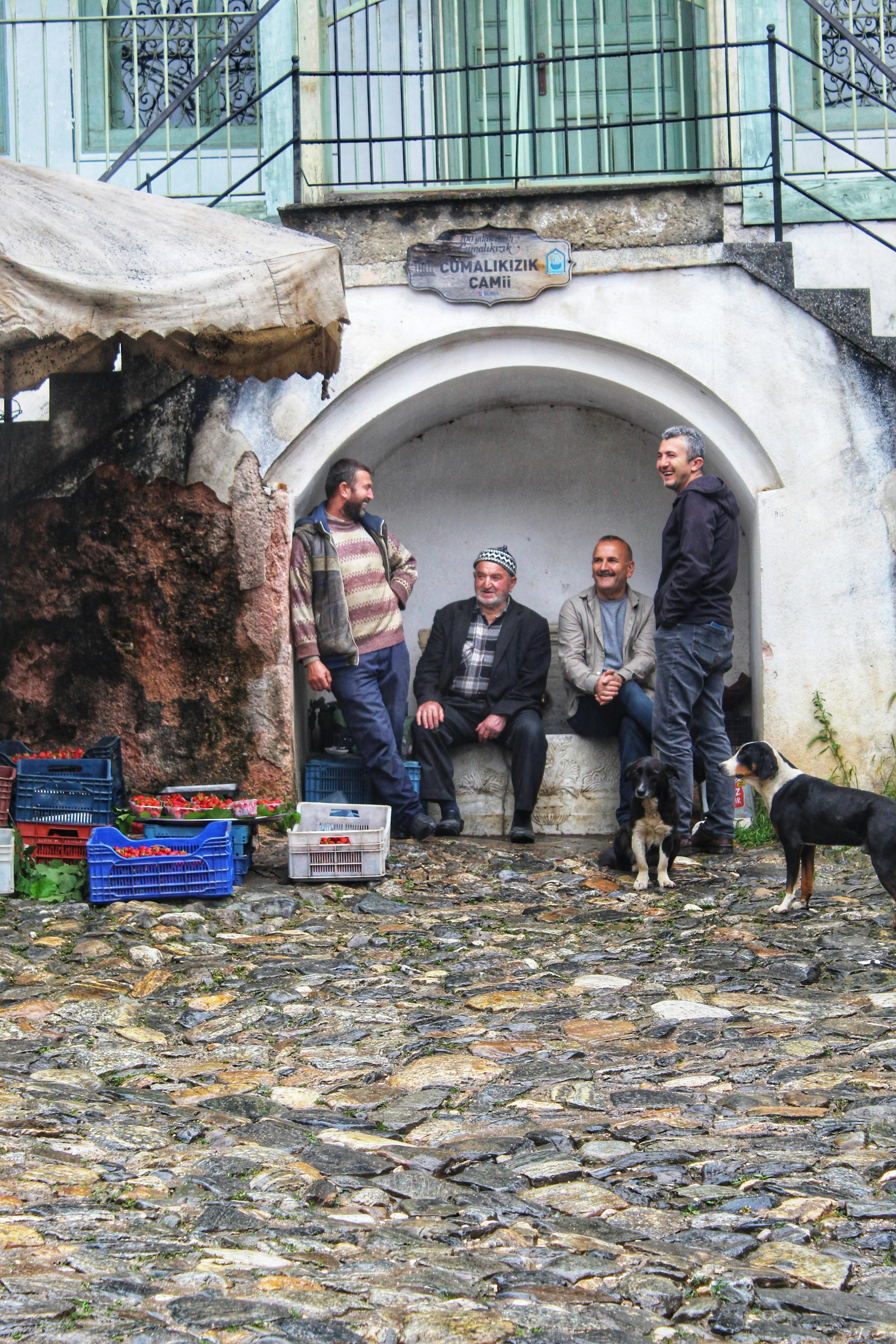 Group of Men Selling Strawberries Sitting Under the Stairs of ...
