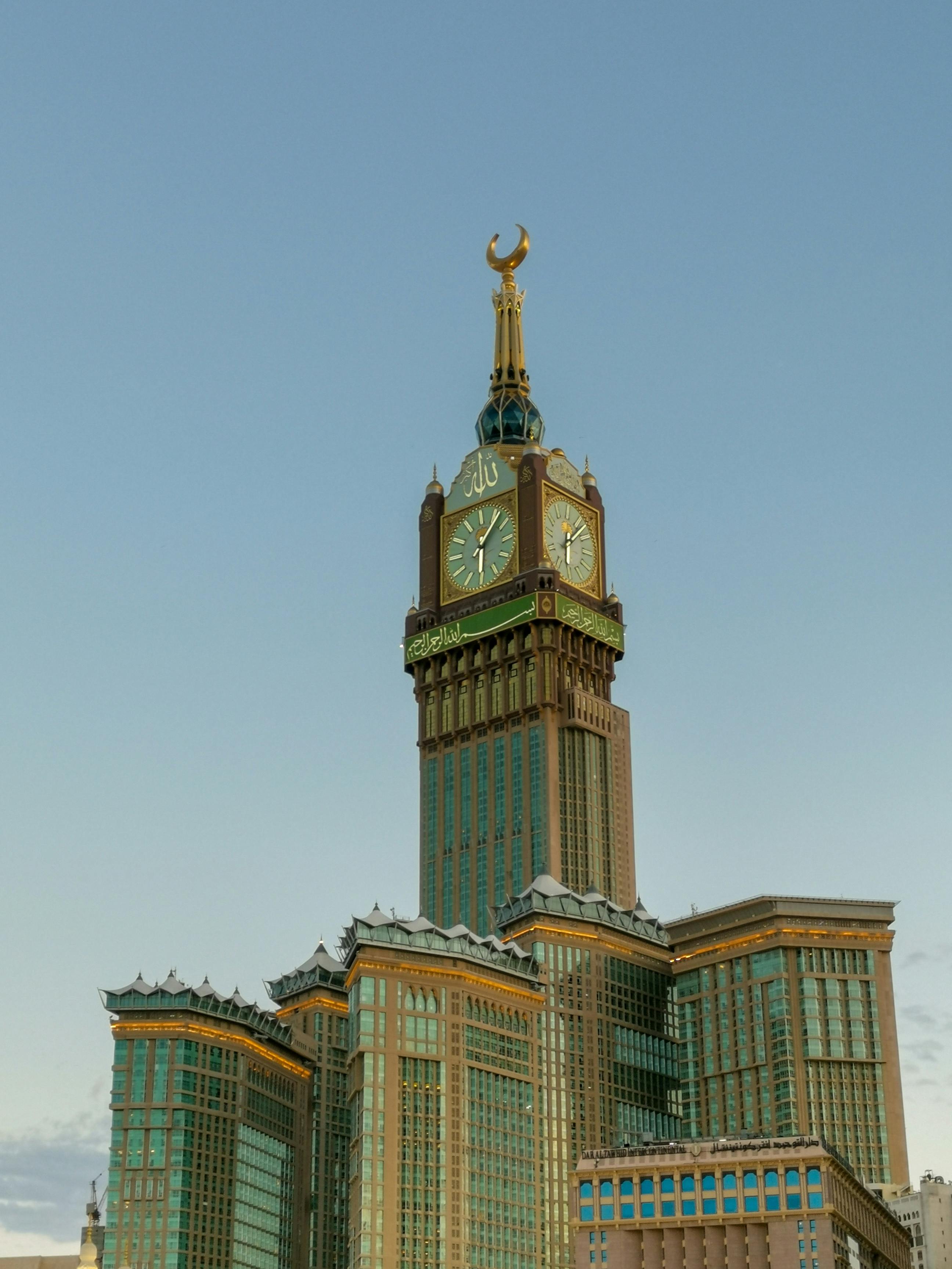 Low Angle Shot of the Mecca Clock Tower with Arabic Script · Free Stock ...