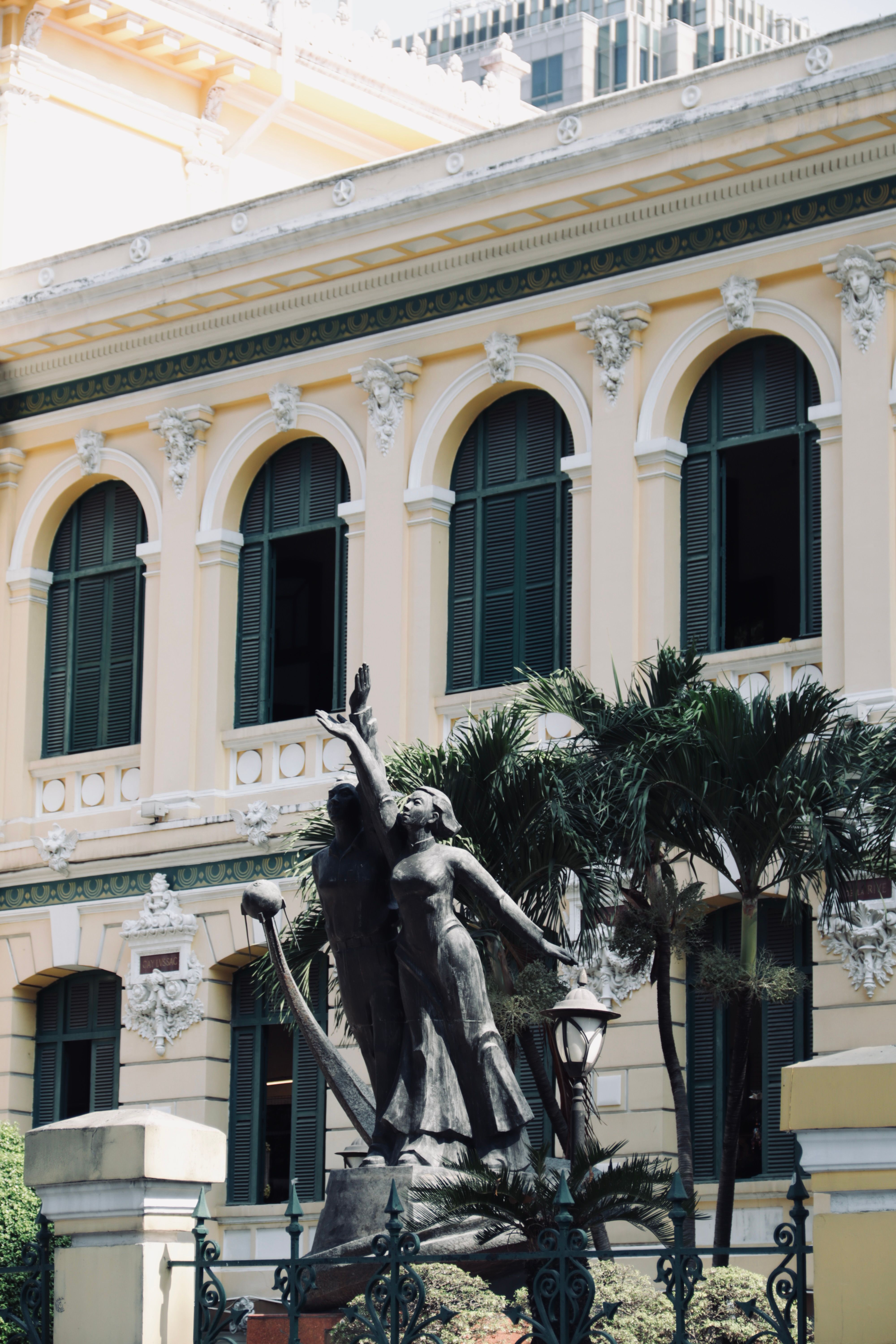A Bronze Statue of People in Front of the General Post Office, Ho Chi ...
