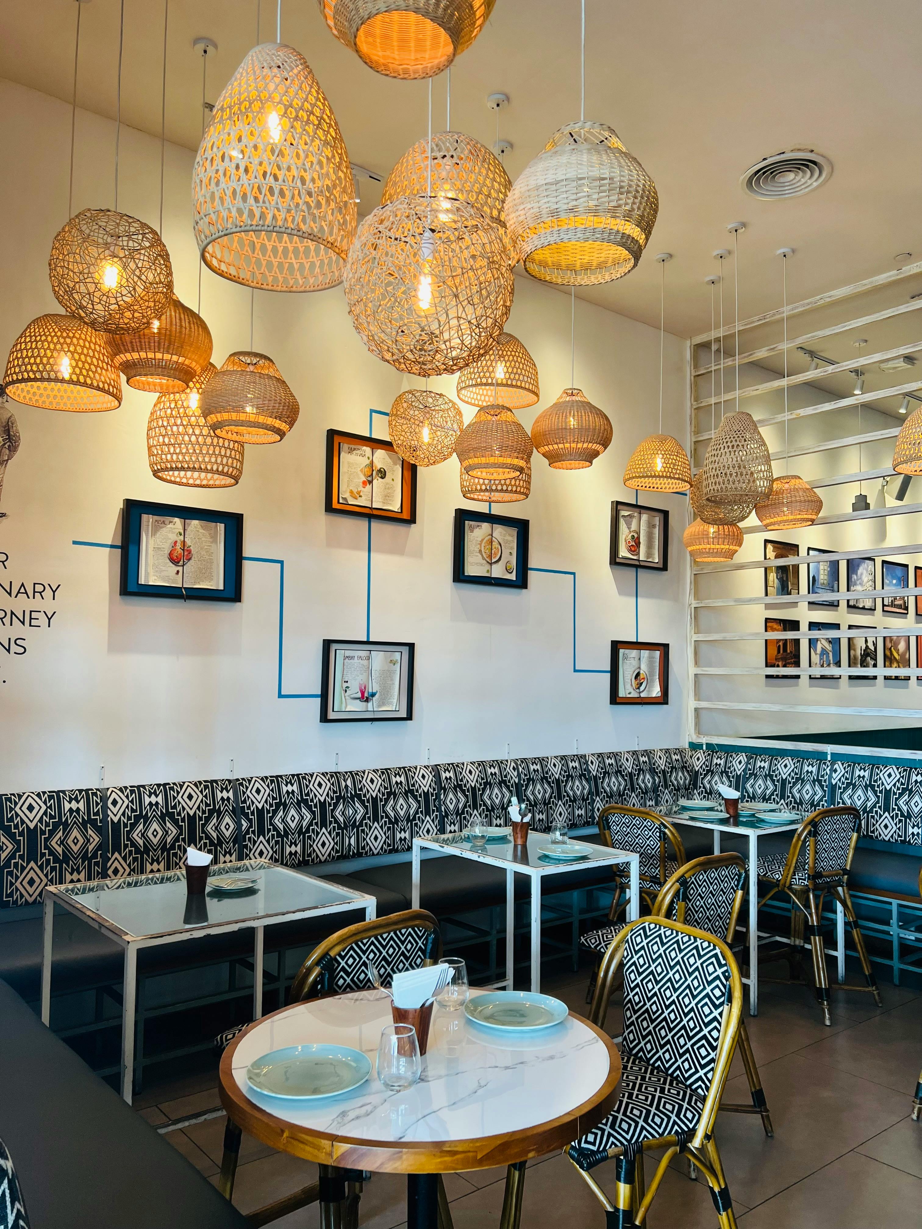 Spacious cafe with various tables · Free Stock Photo