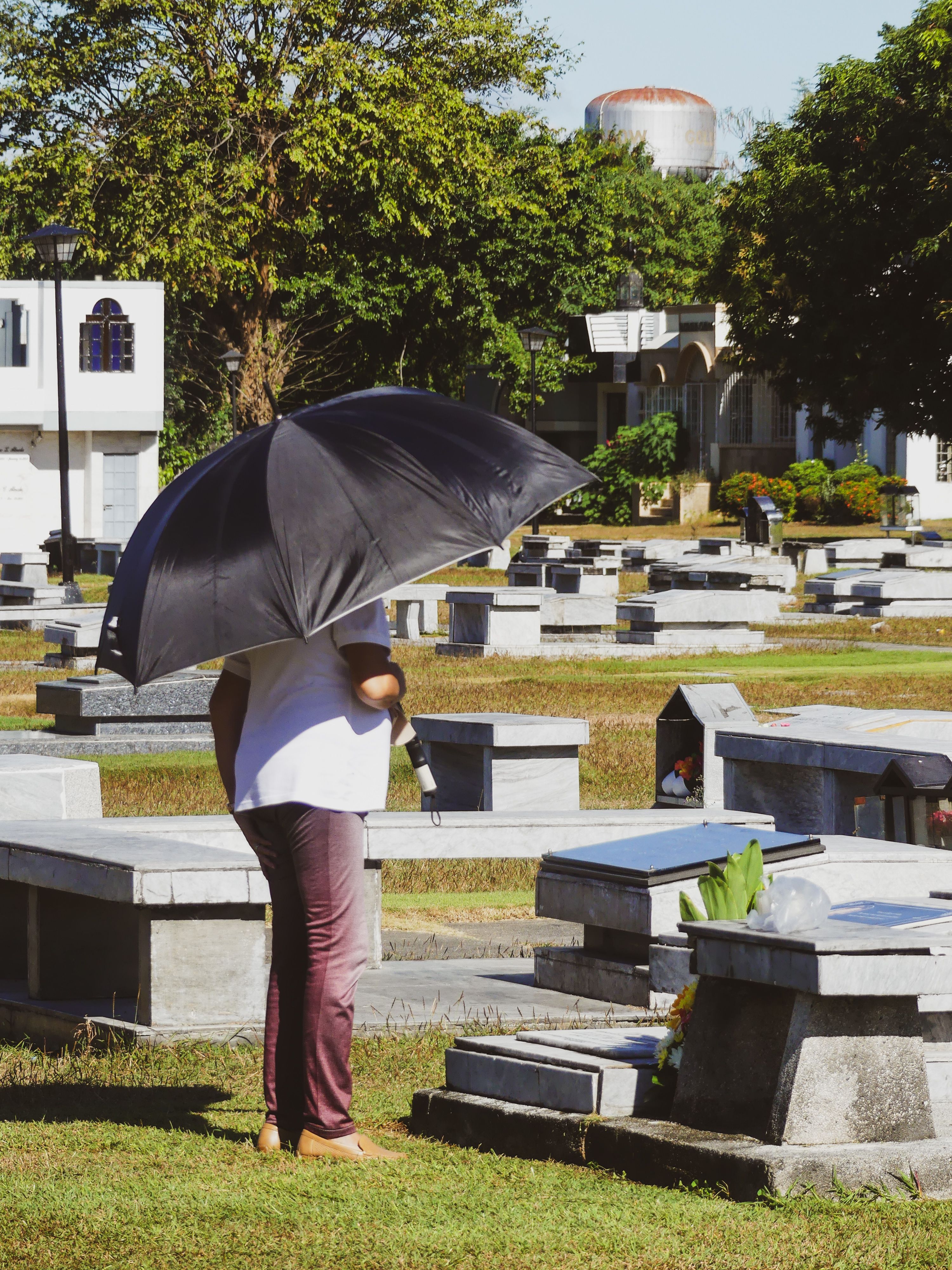 Person with Umbrella at Cemetery · Free Stock Photo